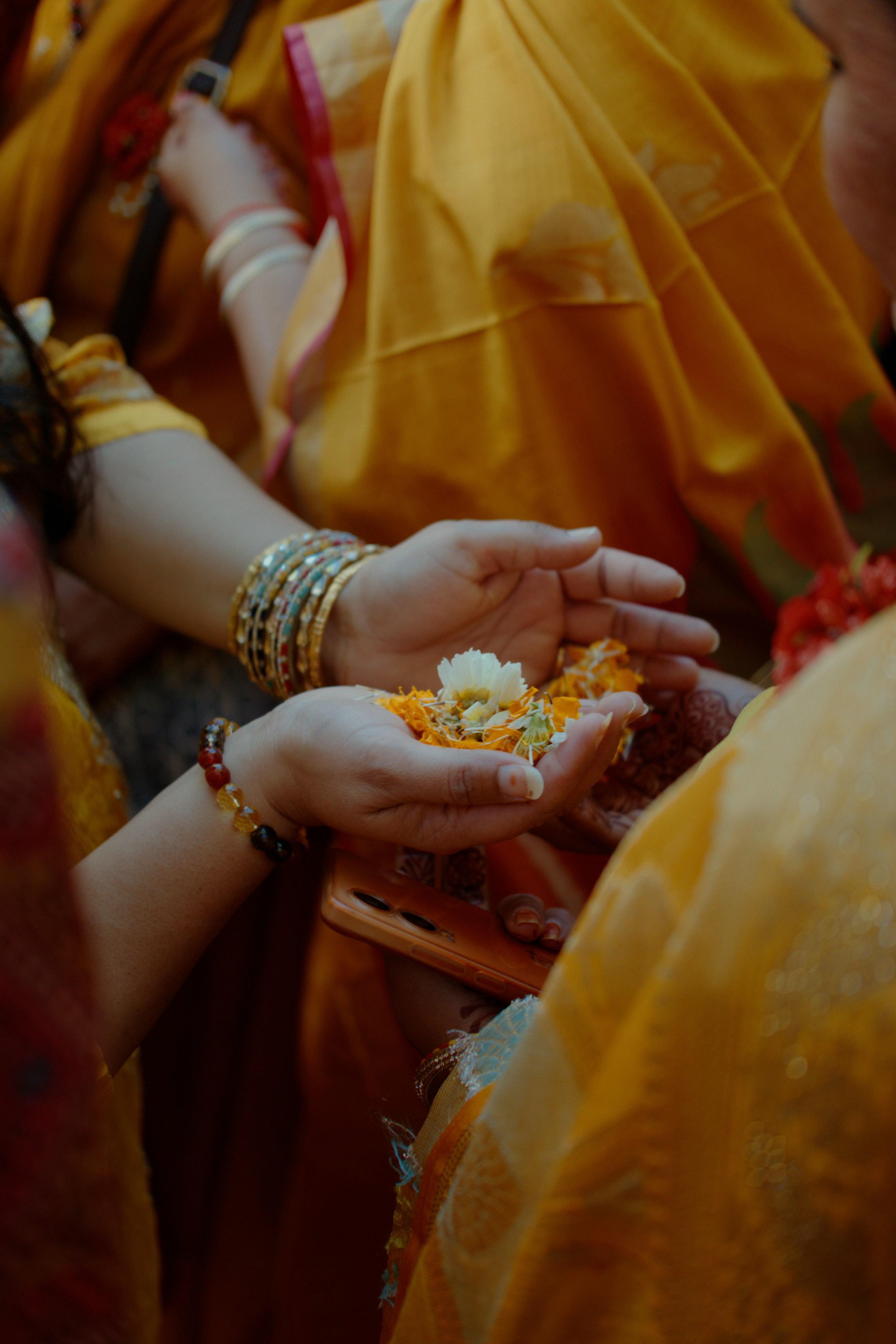 Hands Offering Marigolds: A Moment of Ritual Color