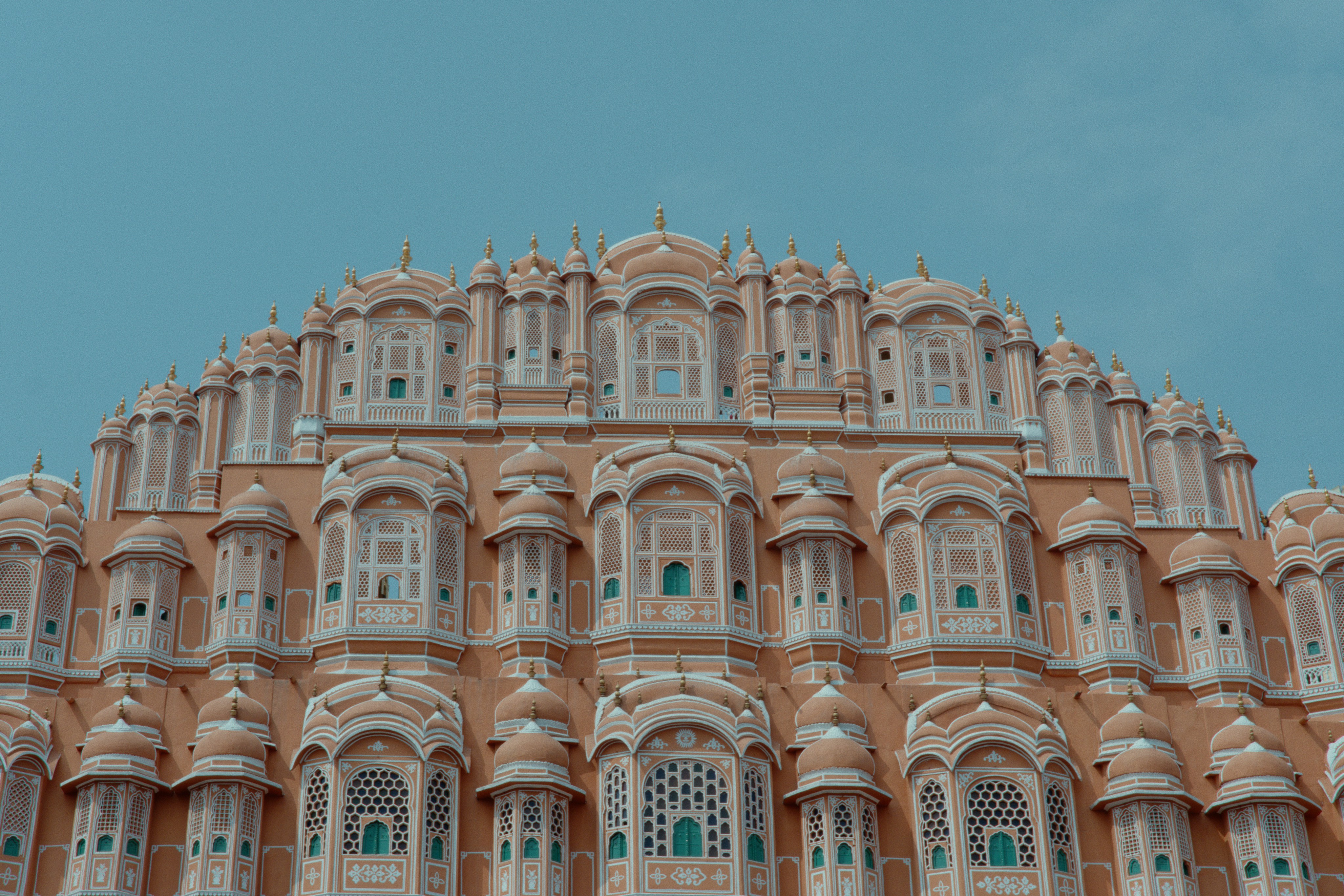 Ornate hawa mahal palace under a clear blue sky.