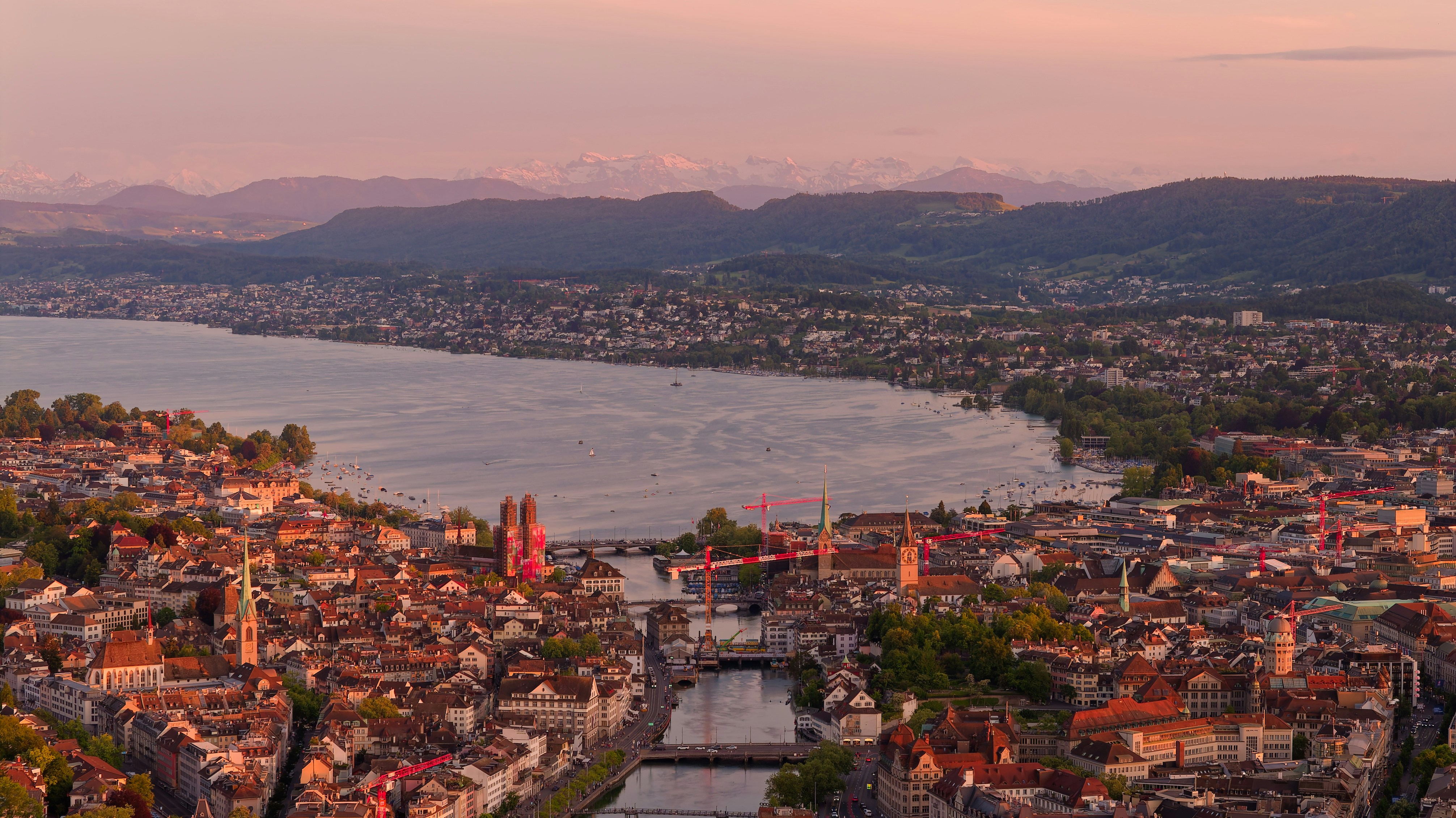 Aerial View Over a Riverside Town at Sunset