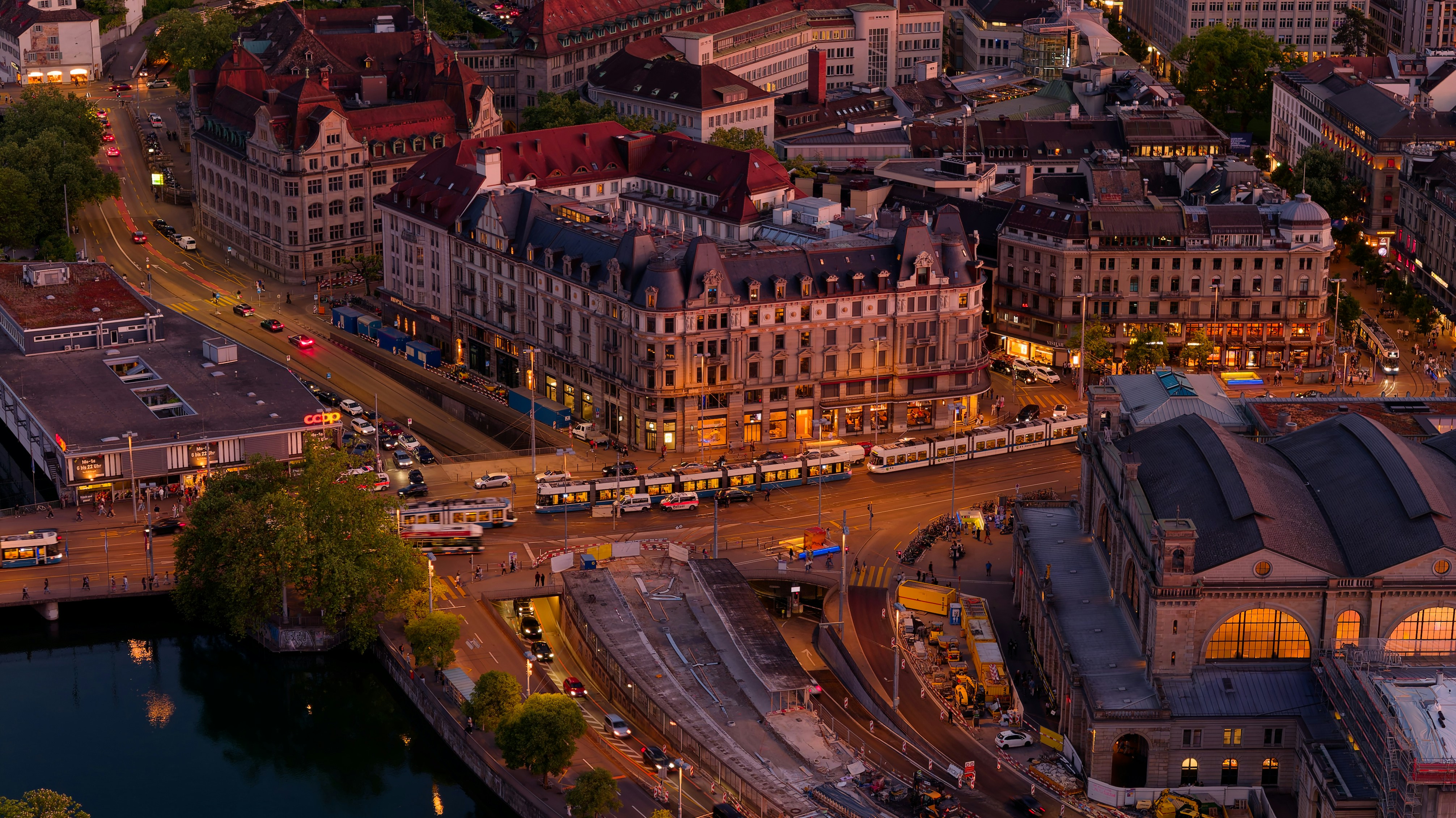Twilight Rails Over a European Riverfront