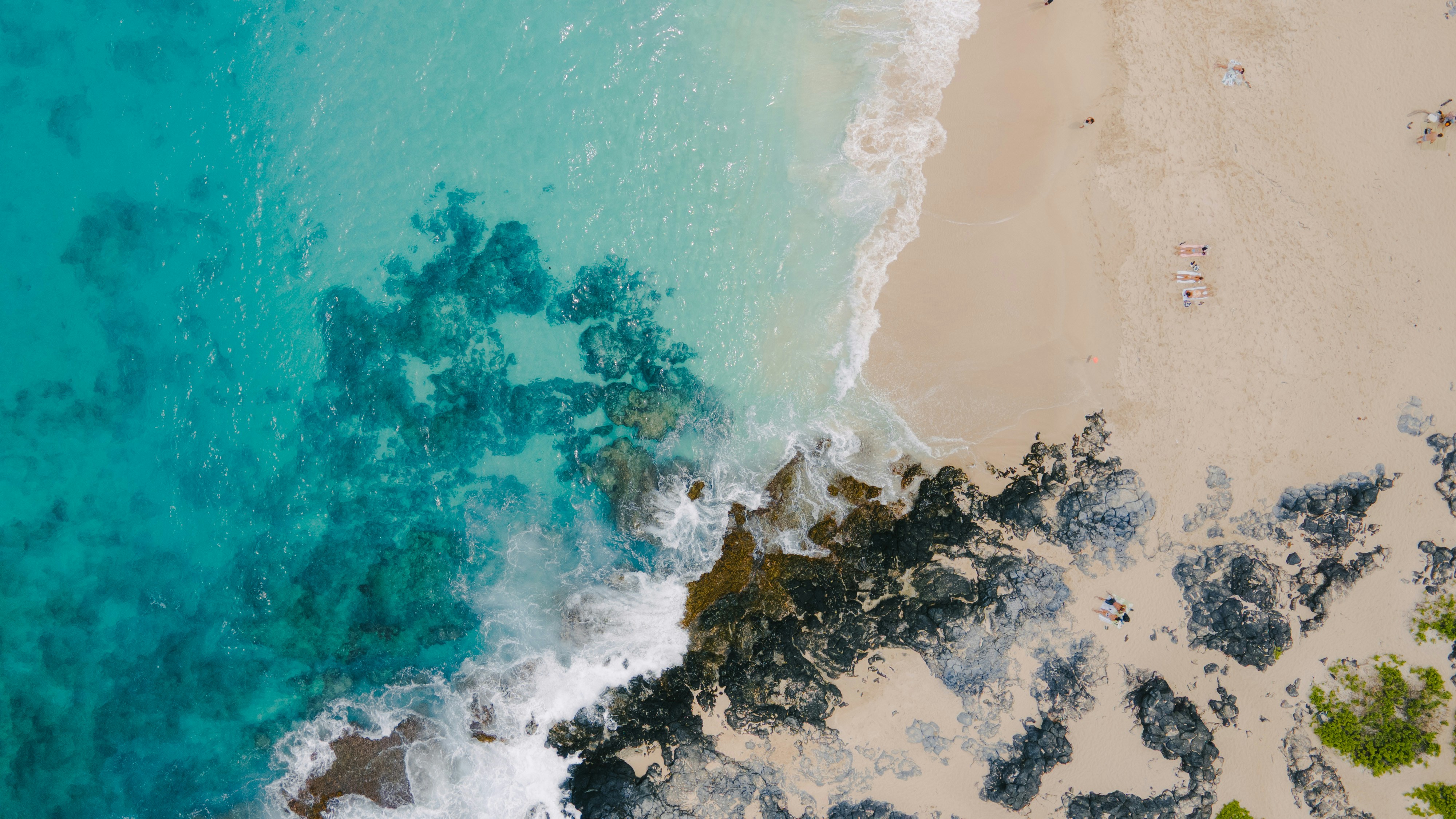 Turbulent Turquoise to Sand: Aerial Edge of Paradise