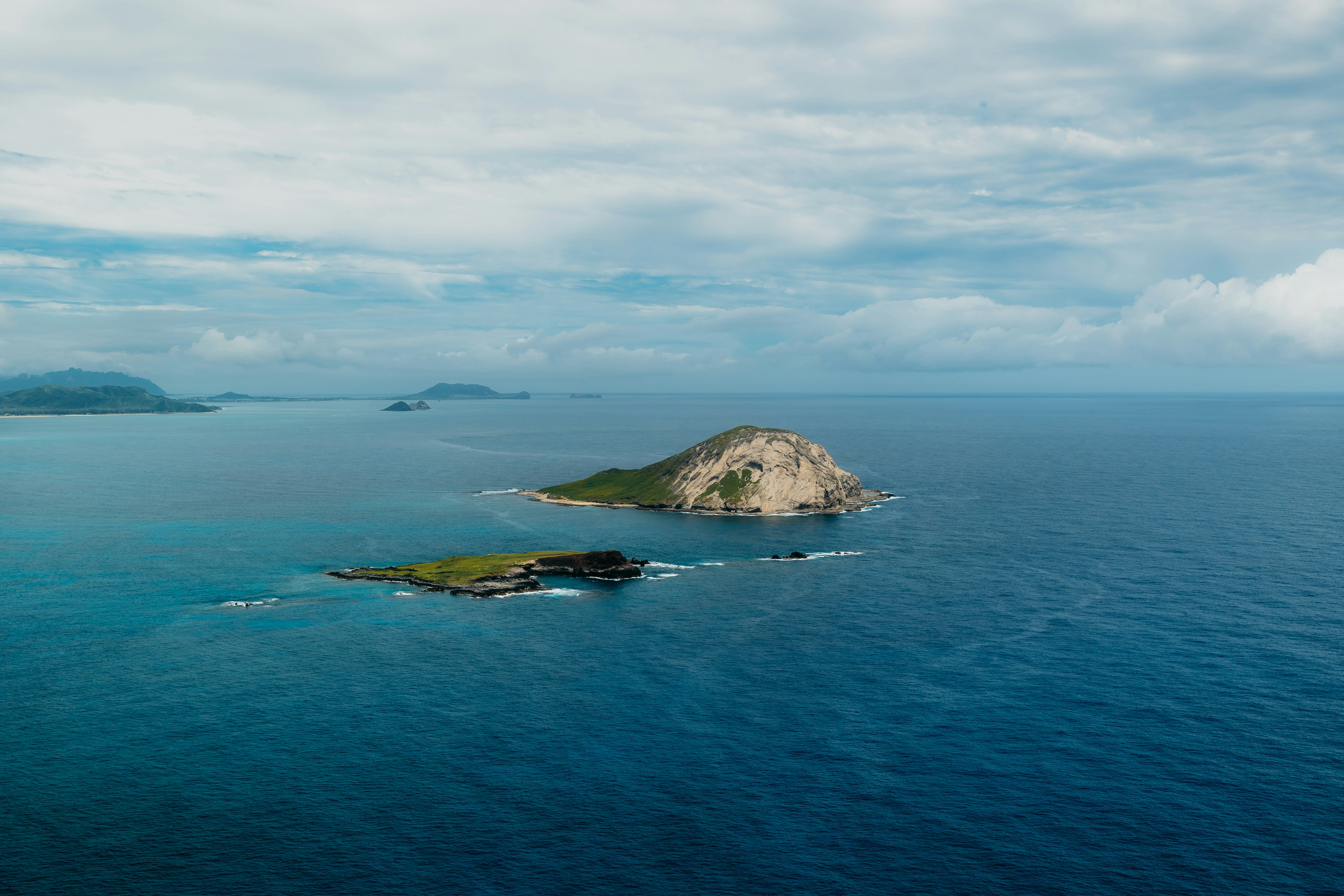 Isolated Island Emergence Above a Serene Pacific Expanse