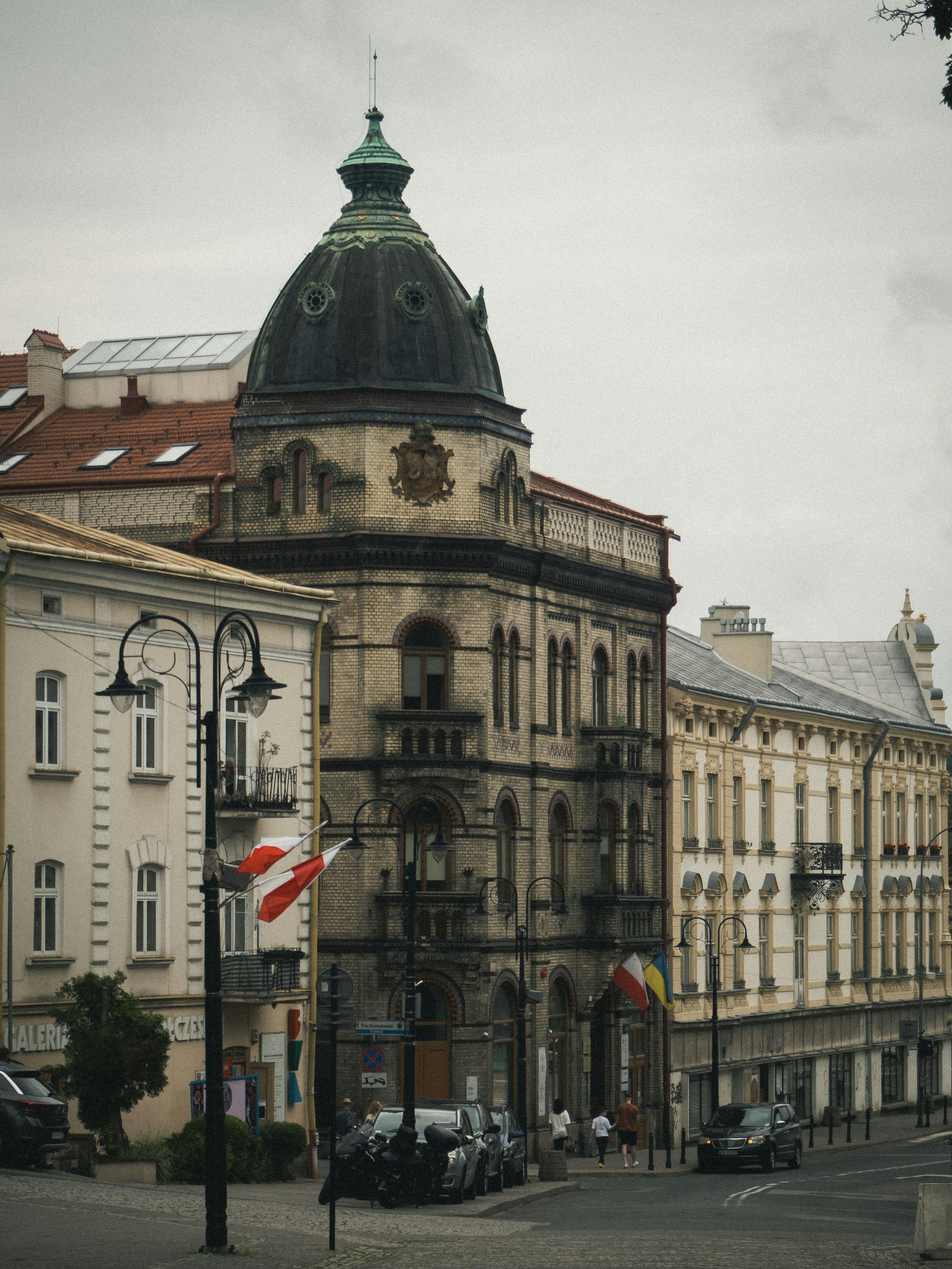 The Green-Domed Facade: A Corner of Time on a Cobbled Street