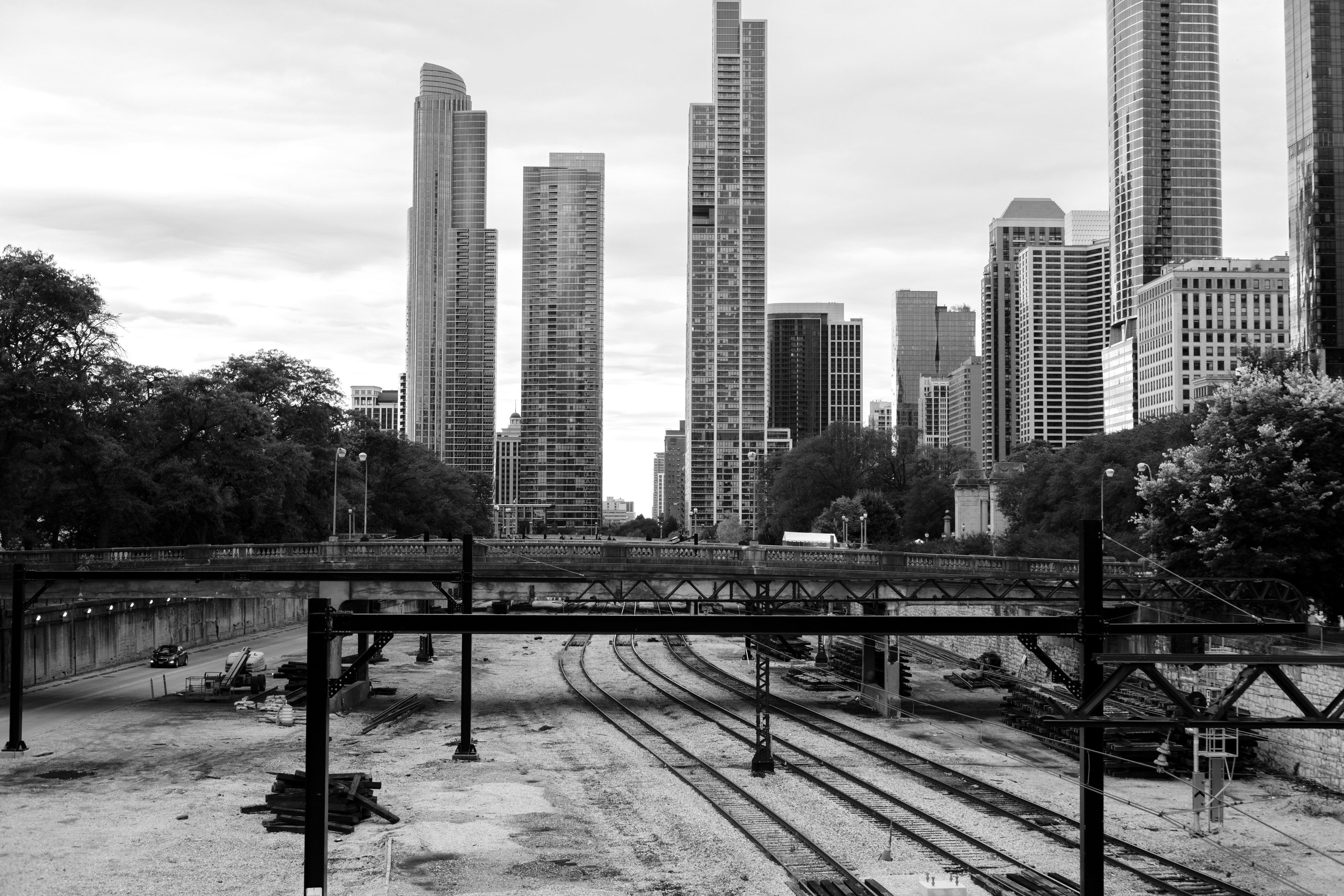 Urban Rails: A Monochrome Skyline Framed by Ground-Level Tracks