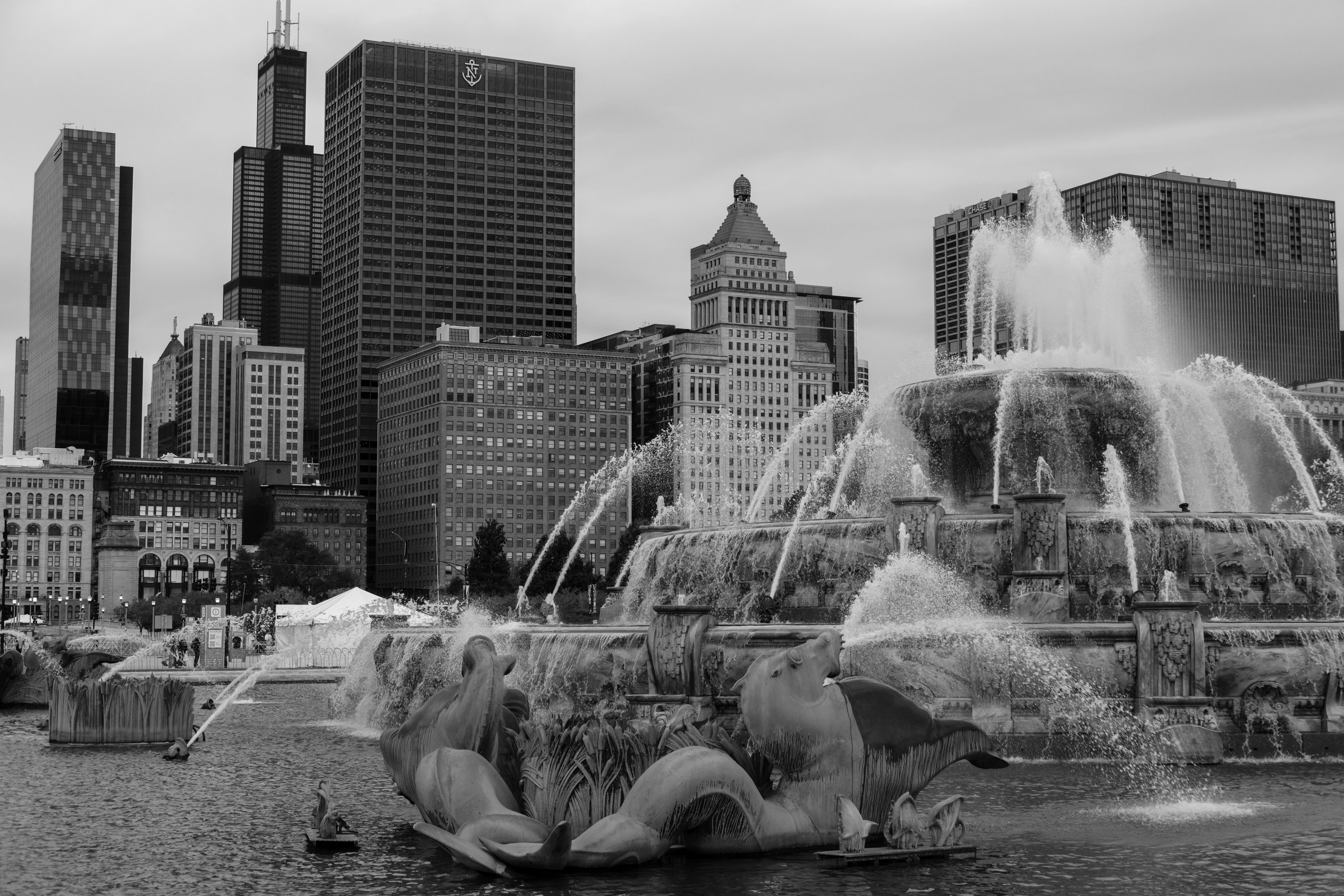 Water Arches Over City: A Black-and-White Fountainfront