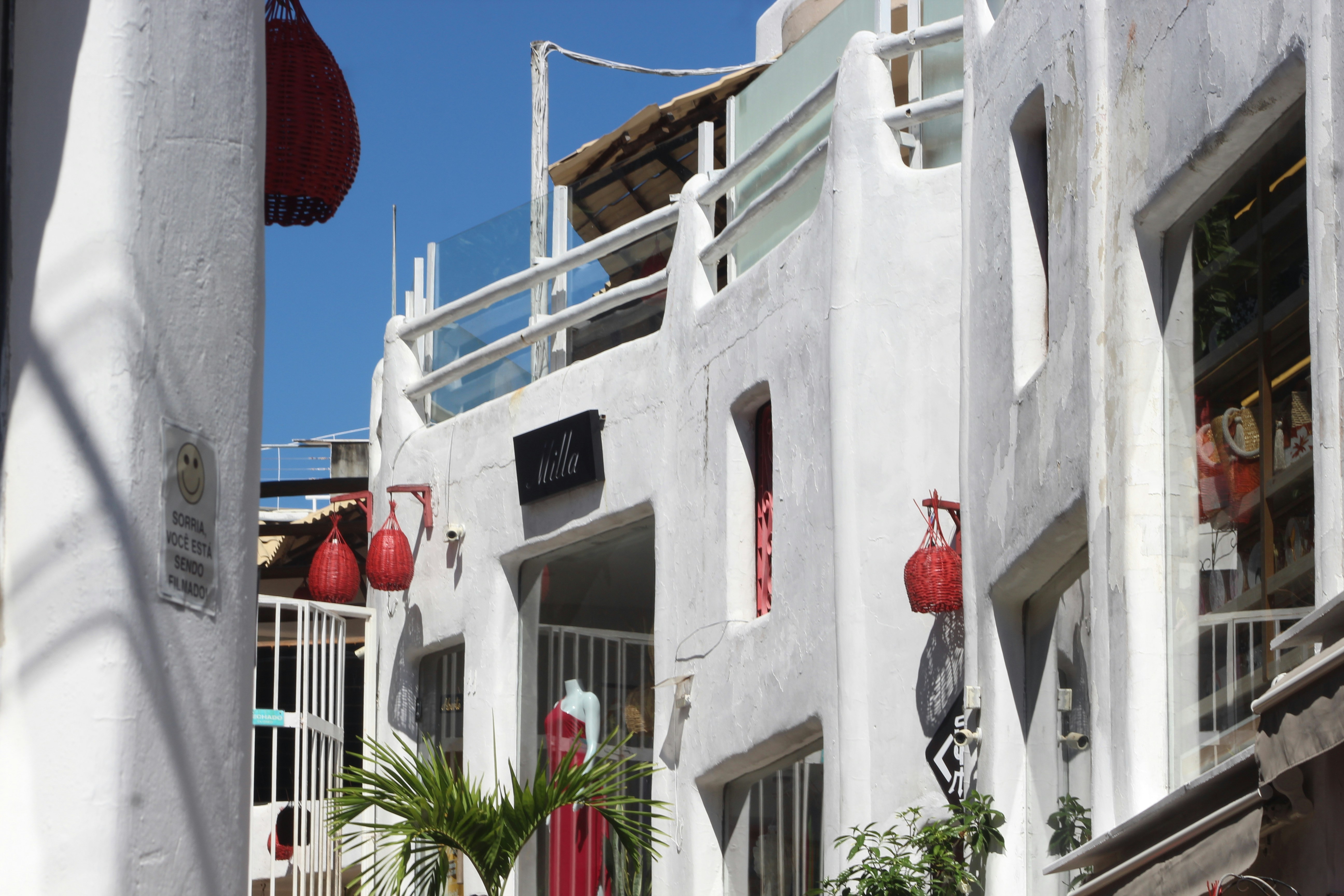 Whitewashed Balcony Utopia with Red Lantern Accents
