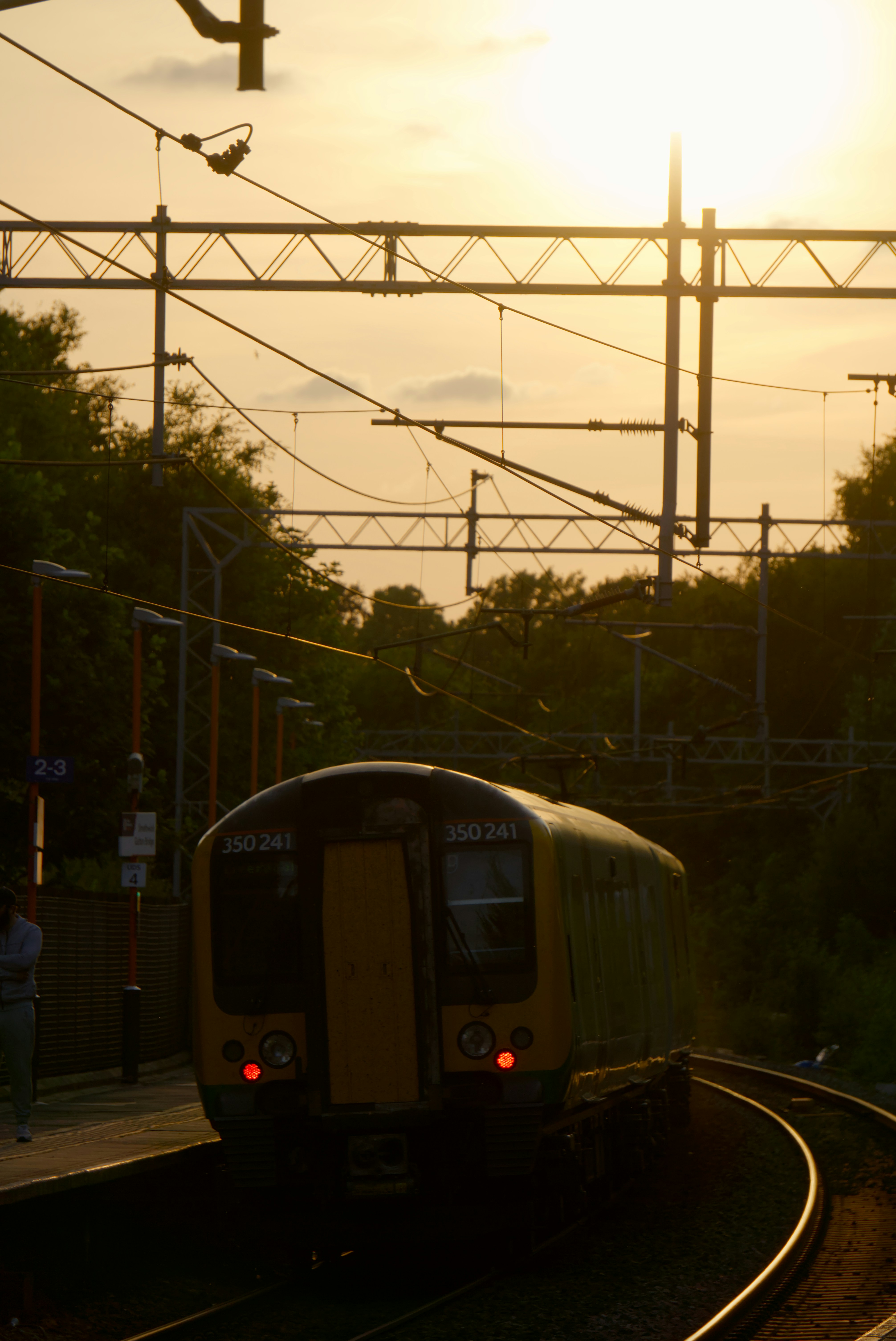 Sunlit Rail Horizon: A Train at Dusk