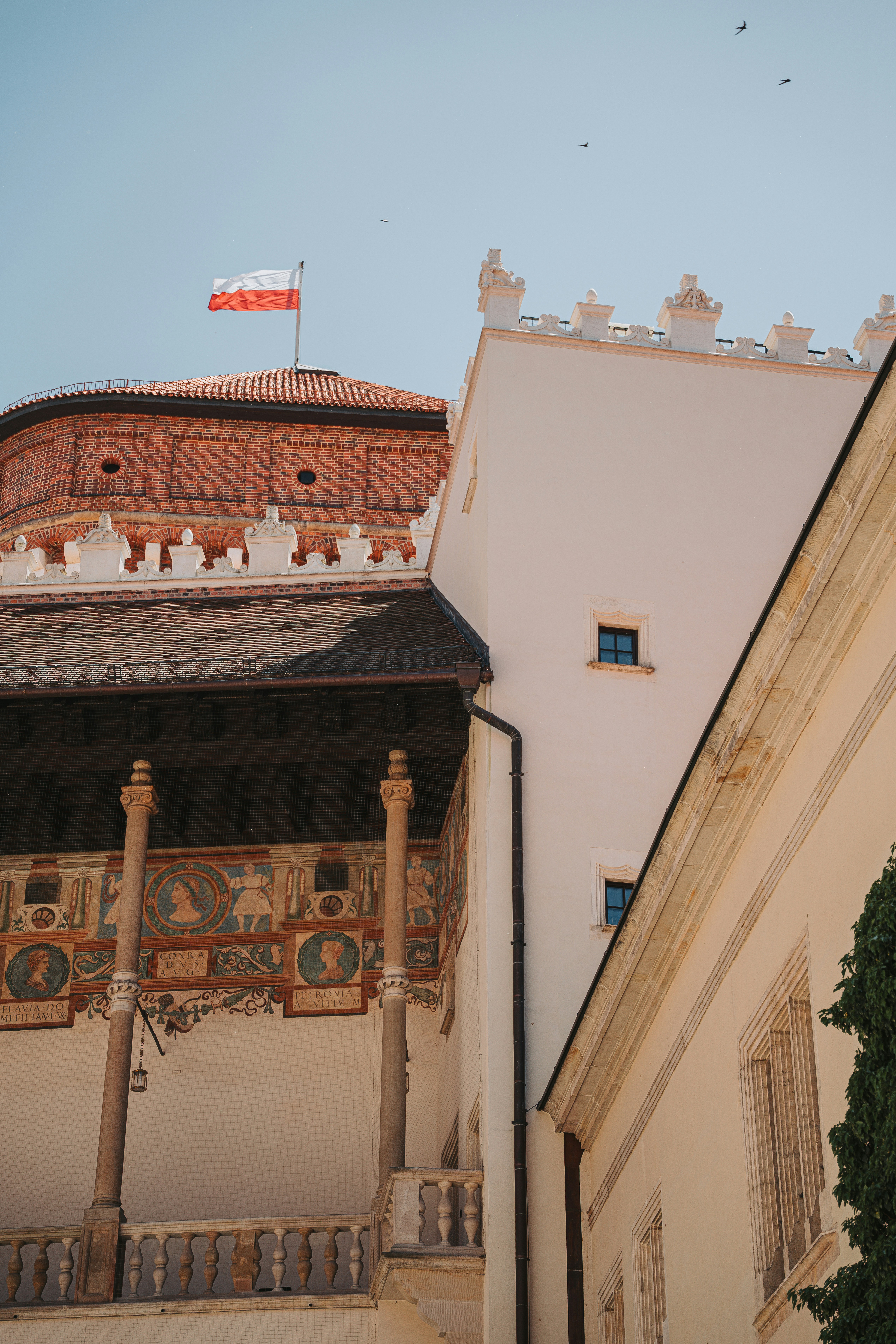 Polished Facade with Polish Flag Over Classical Courtyard