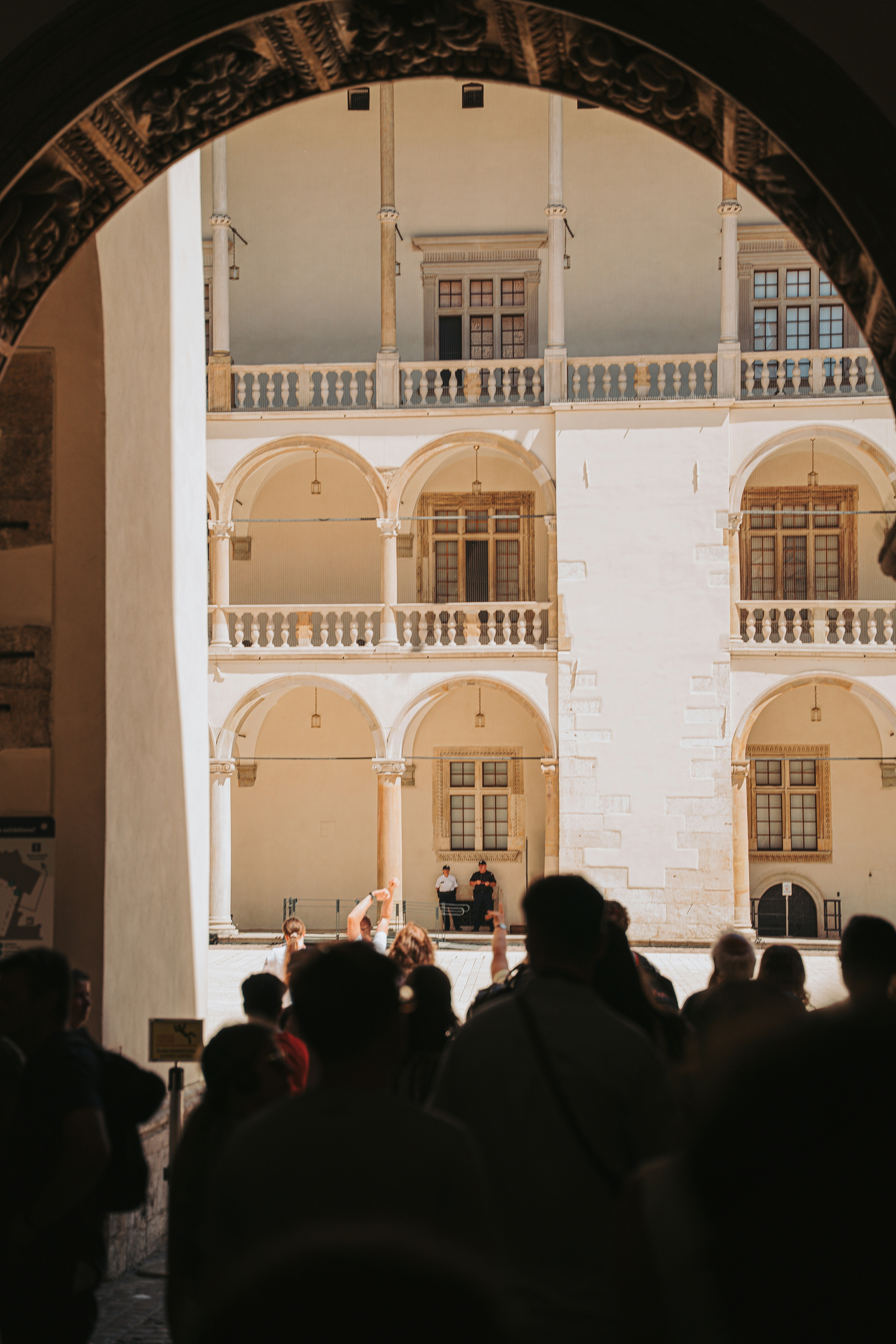 Courtyard Echoes: Shadows and Light in a Sunlit Cloister