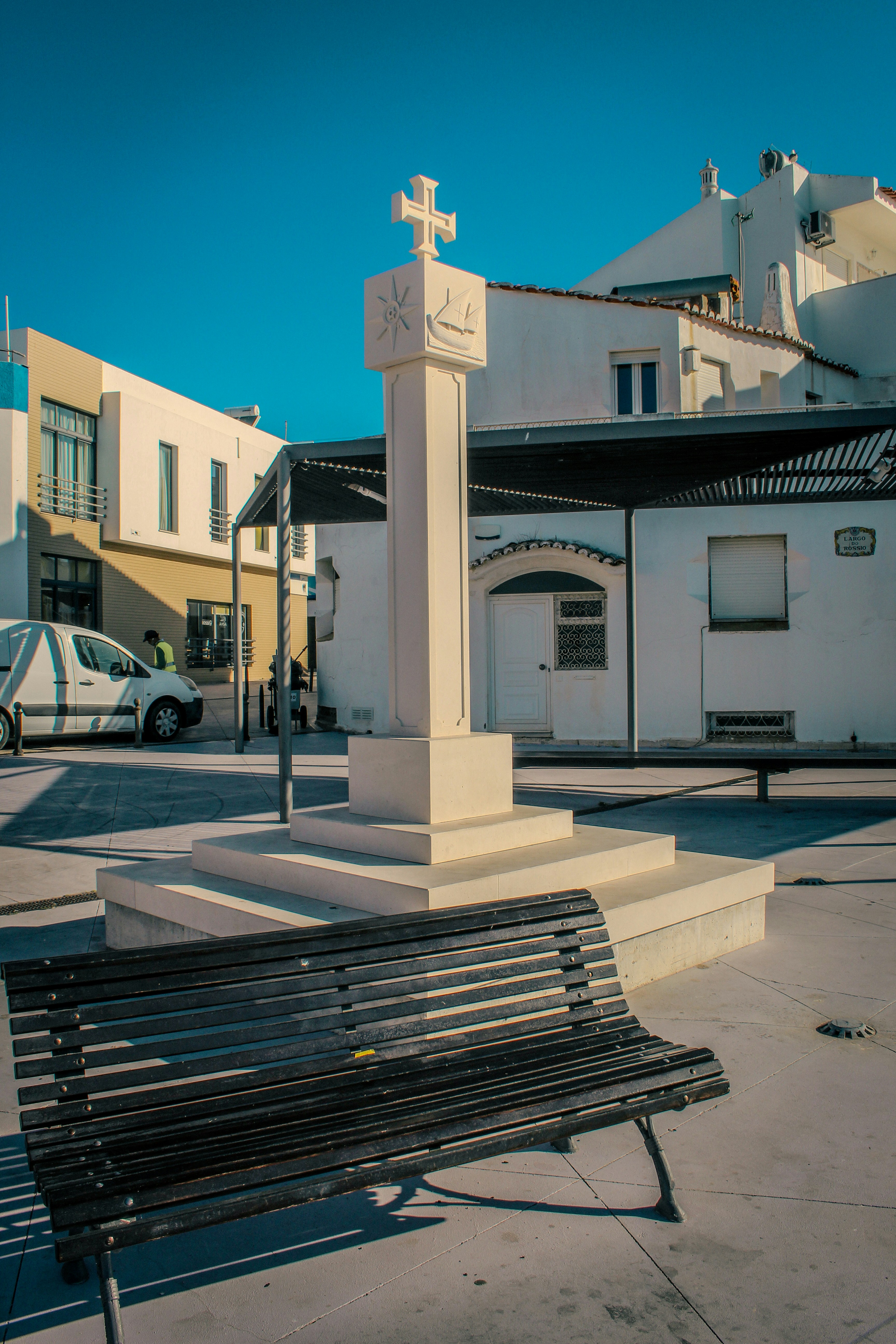 Cruciform Monument in Sunlit Town Square