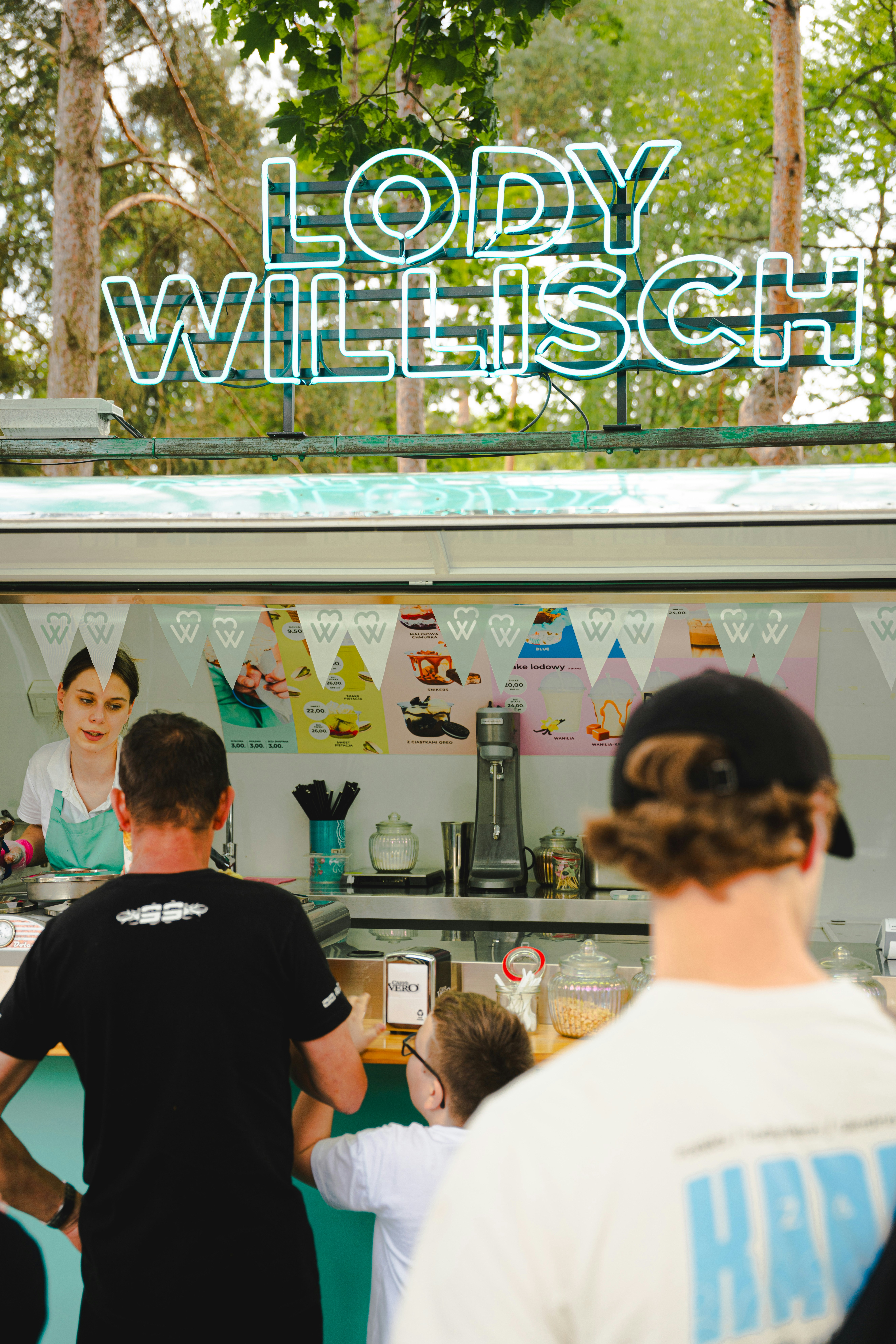 Neon Sign Over a Busy Counter at Lody Willisch