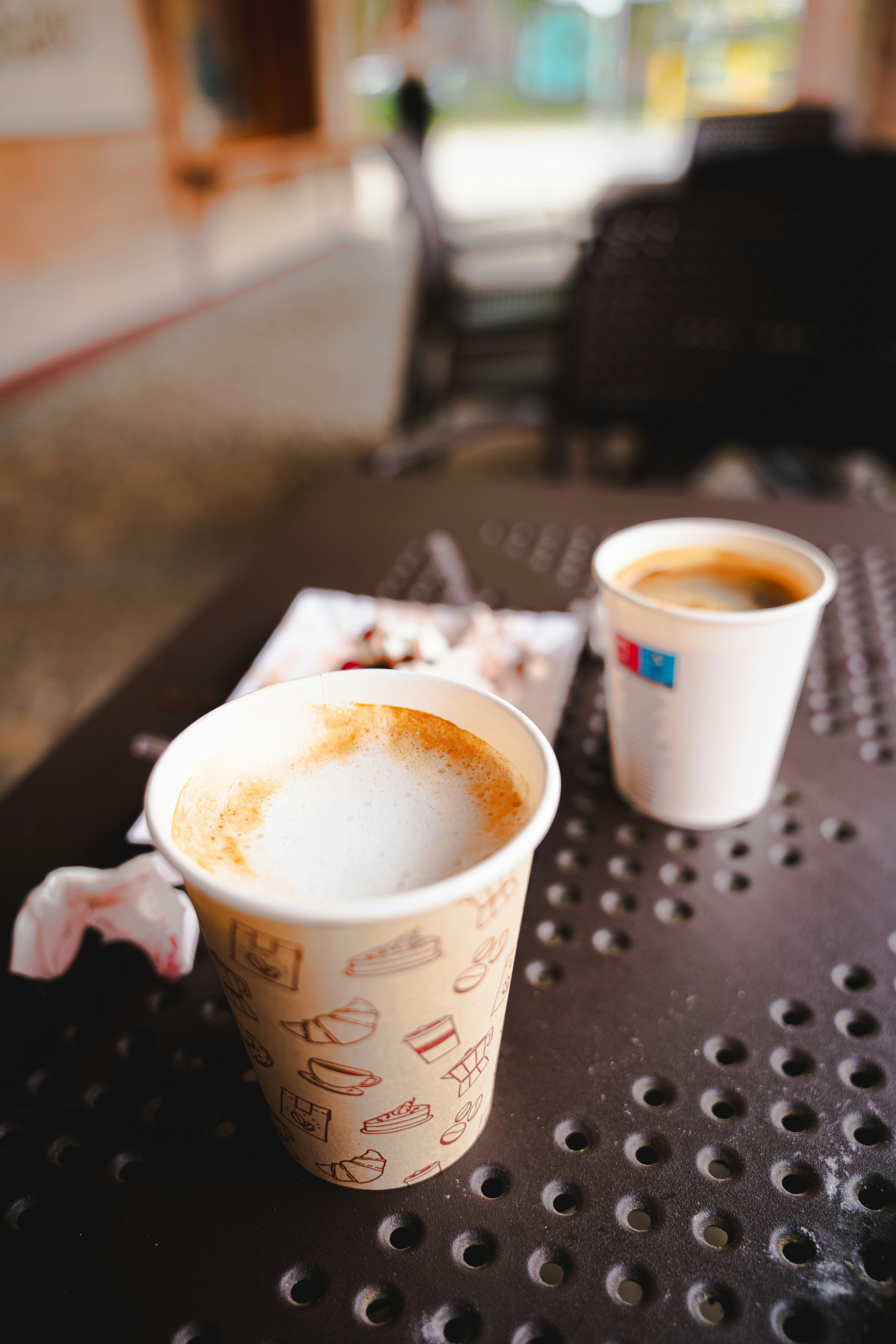 Cafe Cups in Soft Focus: Quiet Morning at the Outdoor Table