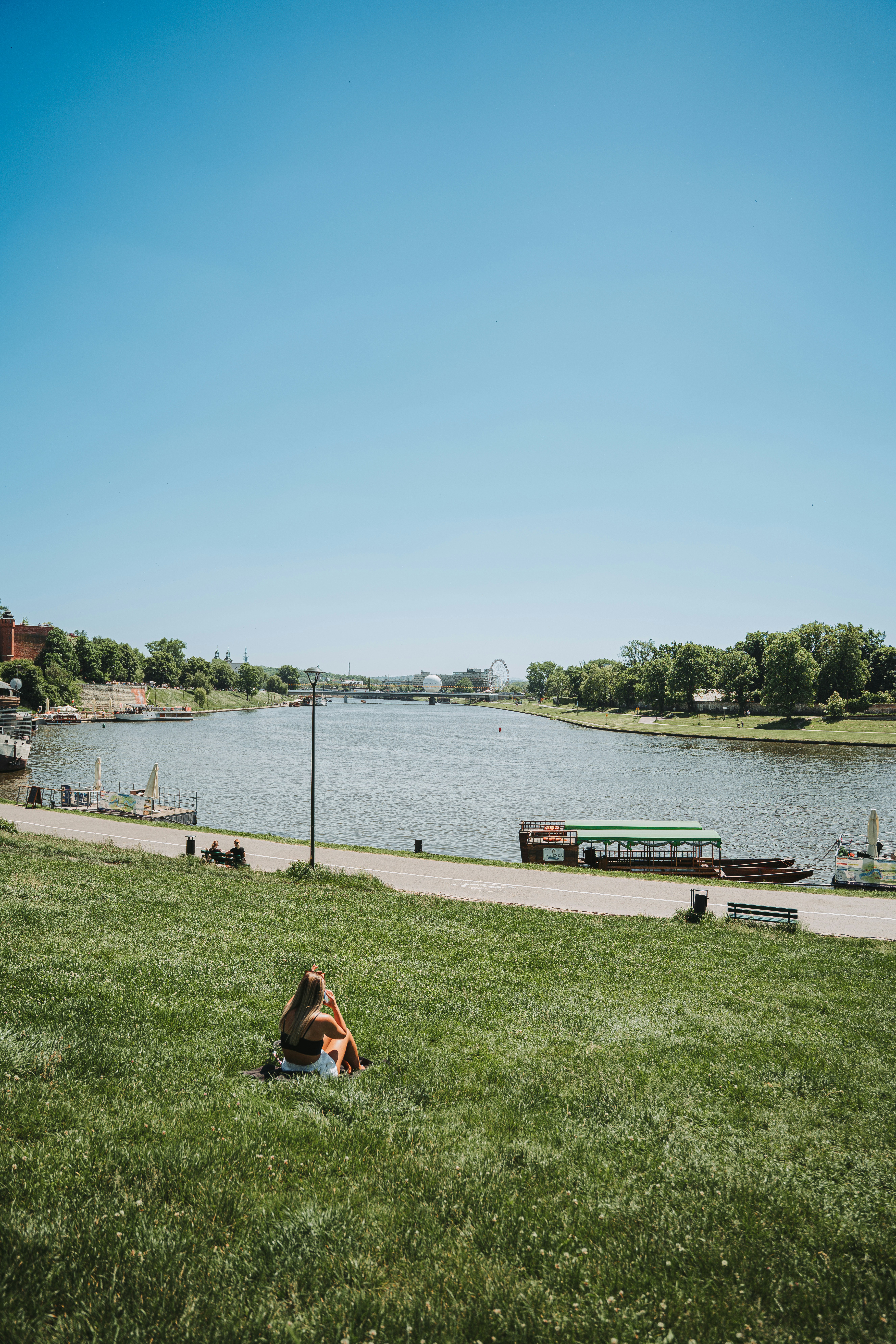 Lawn by the River: Quiet Moment Beneath a Wide Sky