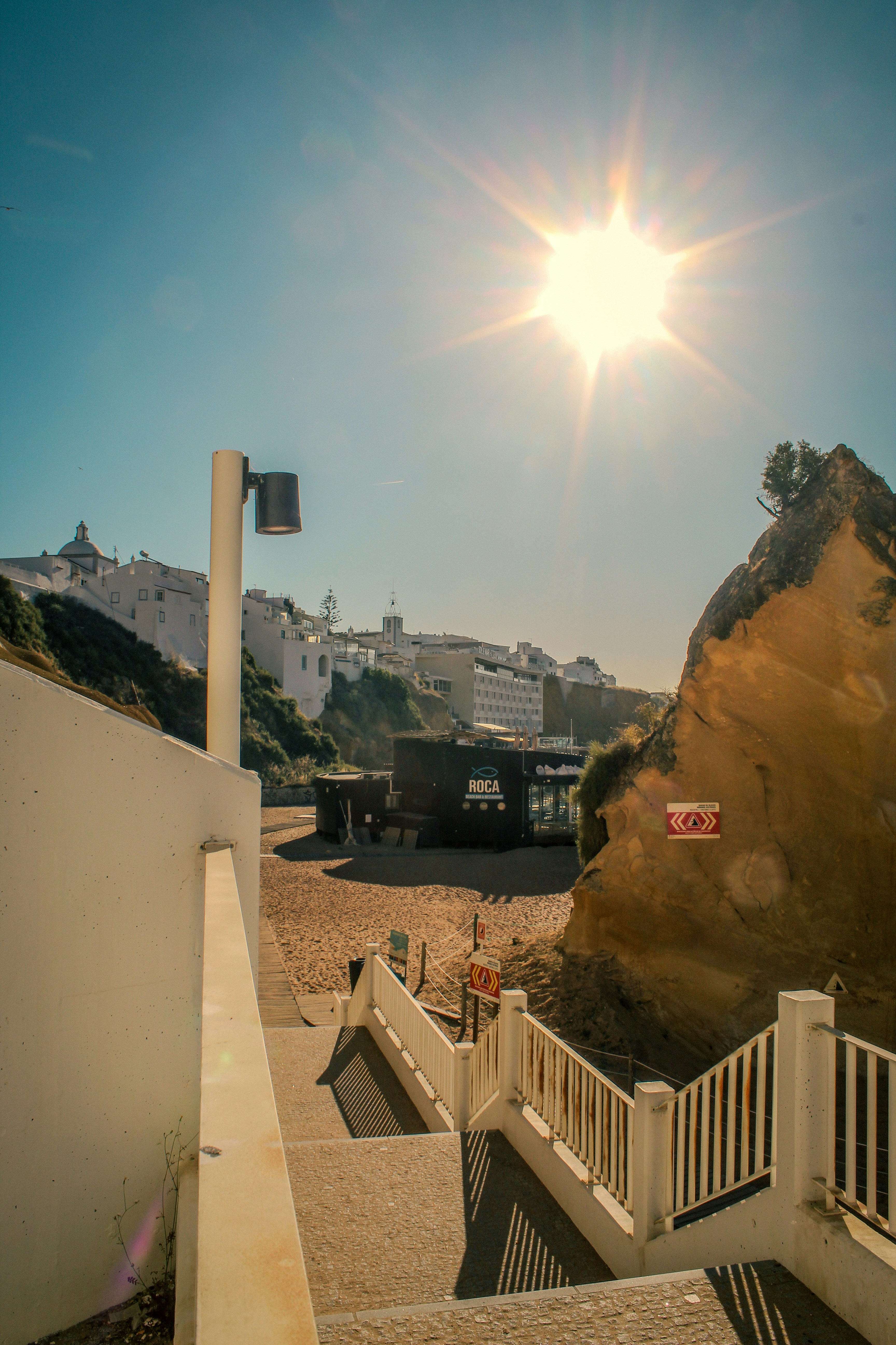 Sunlit Terrace Overlooking a Coastal Cliff Town