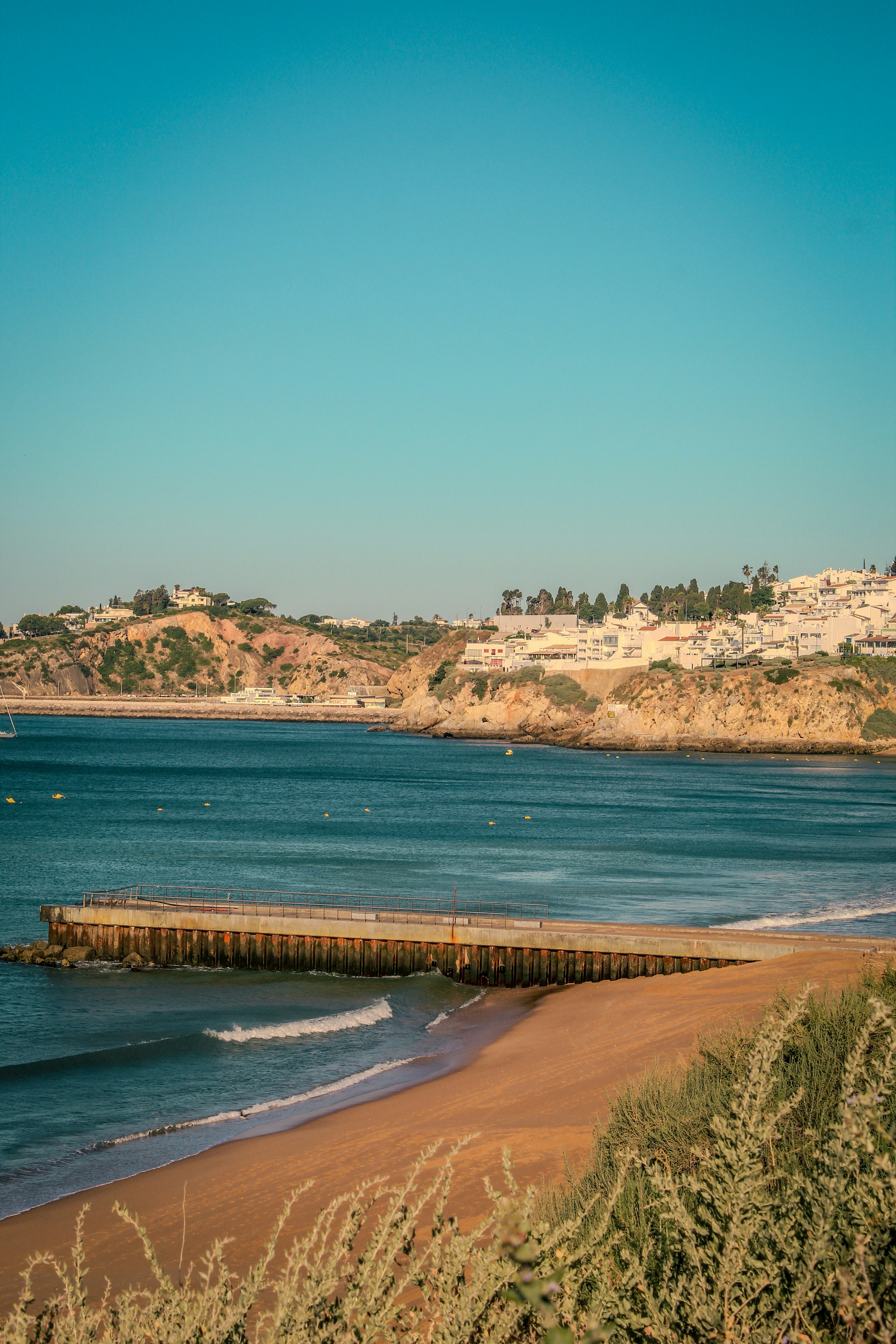 Coastal Bay Vista: A Quiet Slip of Shore Beneath a Turquoise Sky