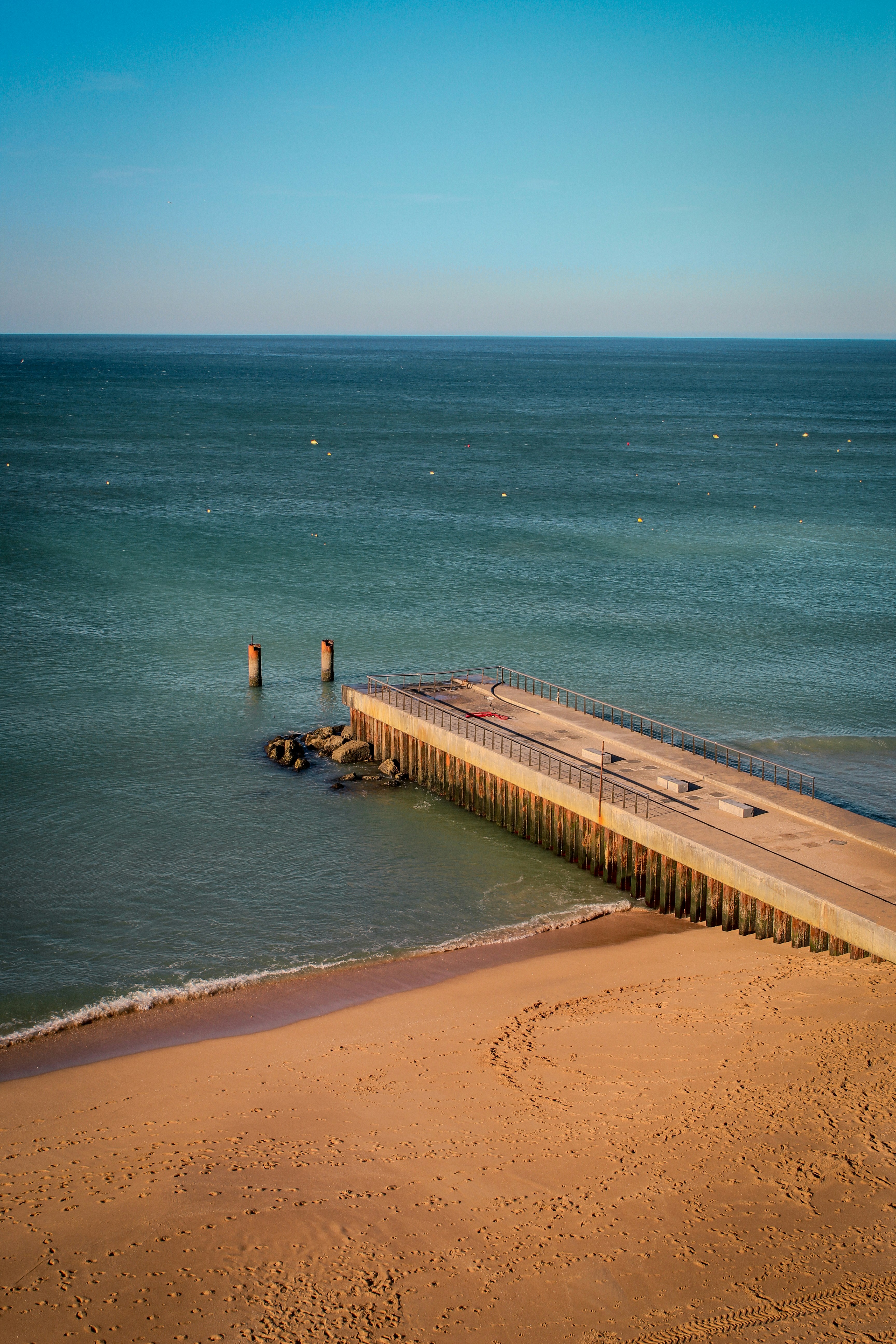 Coastal Pier Reaching Toward a Quiet Horizon