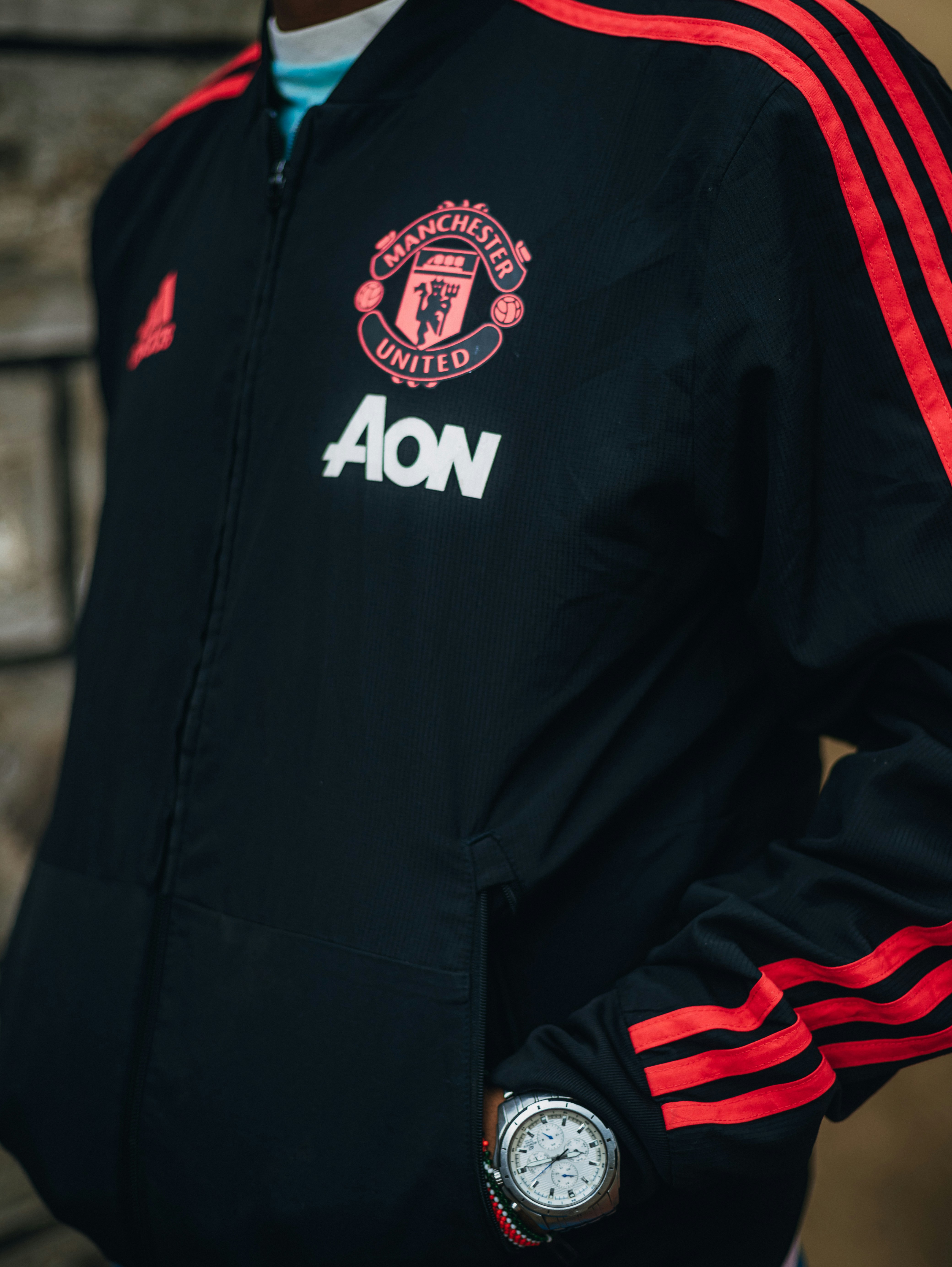 Man United Jacket: Close-Up of Team Crest and Chronograph