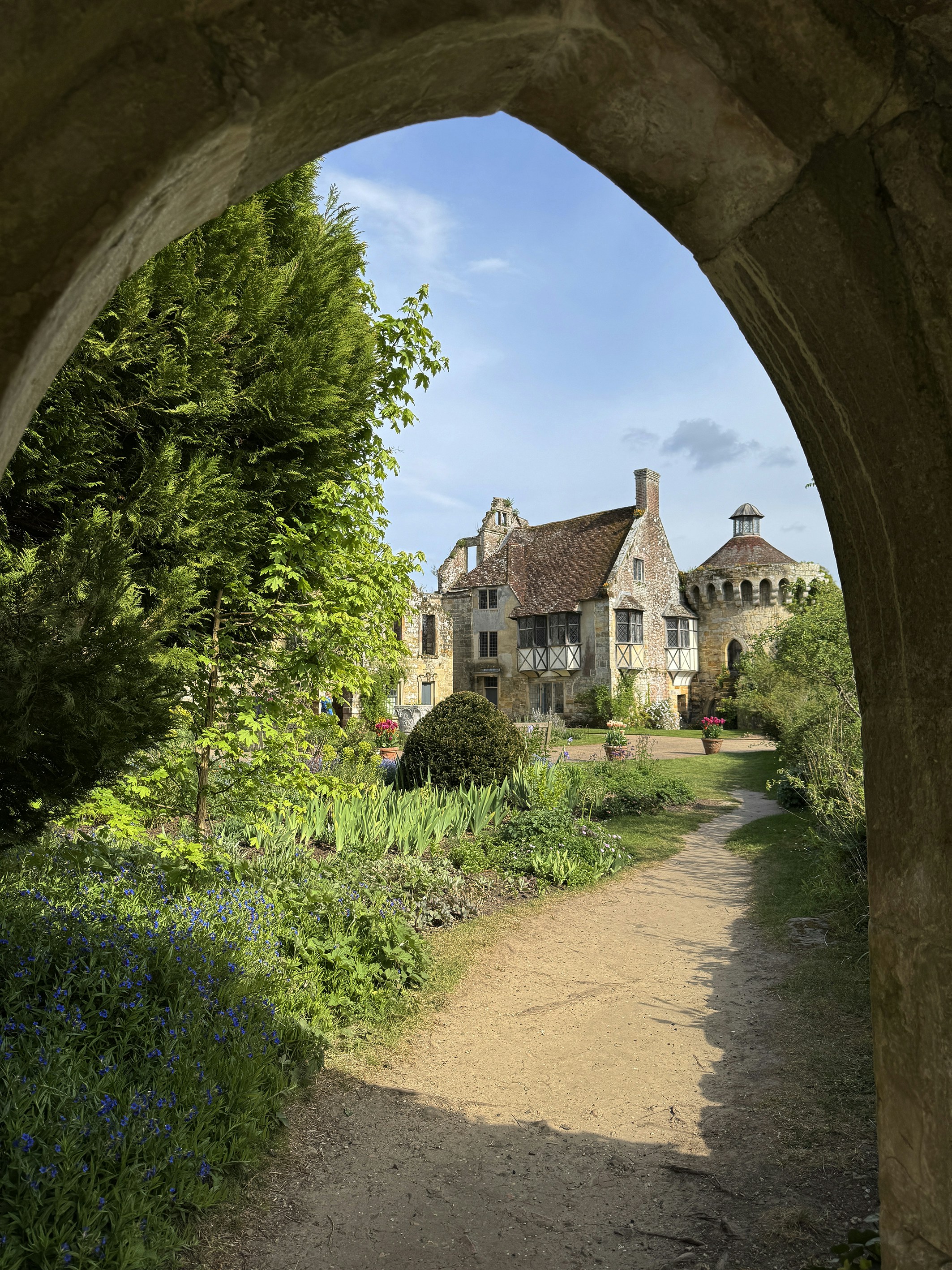 Garden Gate: Sunlit Path to a Historic Manor