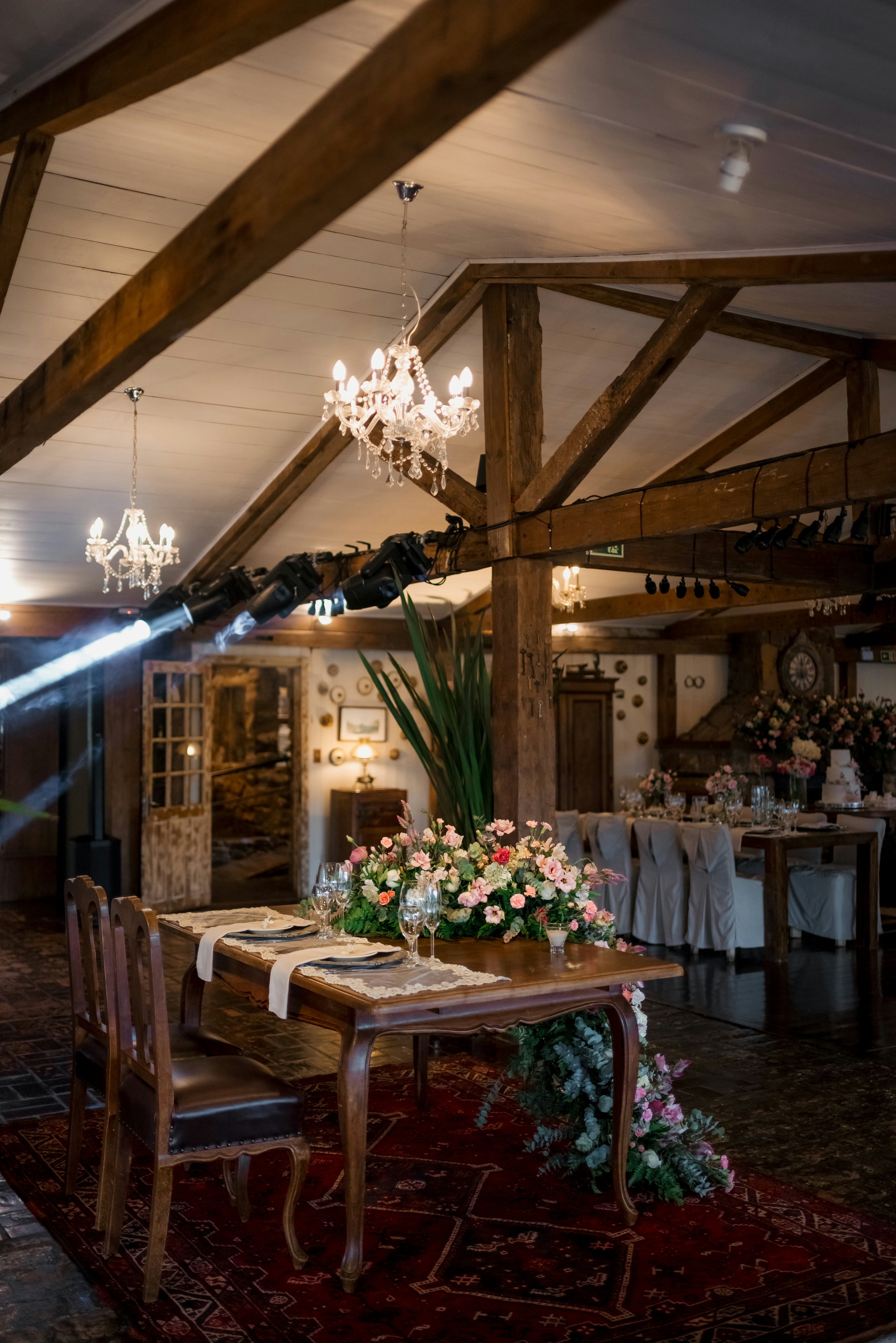 Floral Table Ensemble Under Rustic Beams
