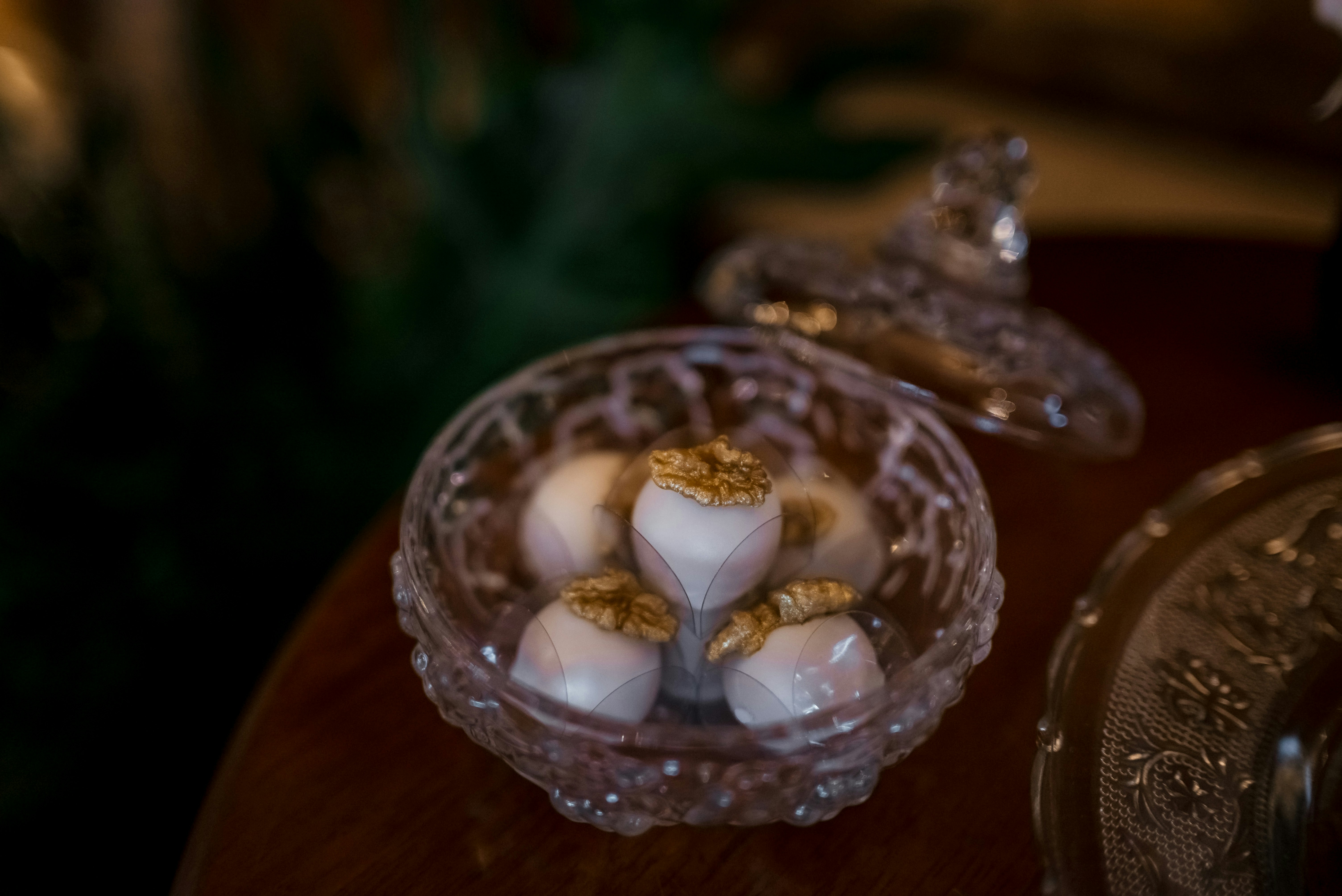 Crystal Bowl of Confections Under Ambient Glow