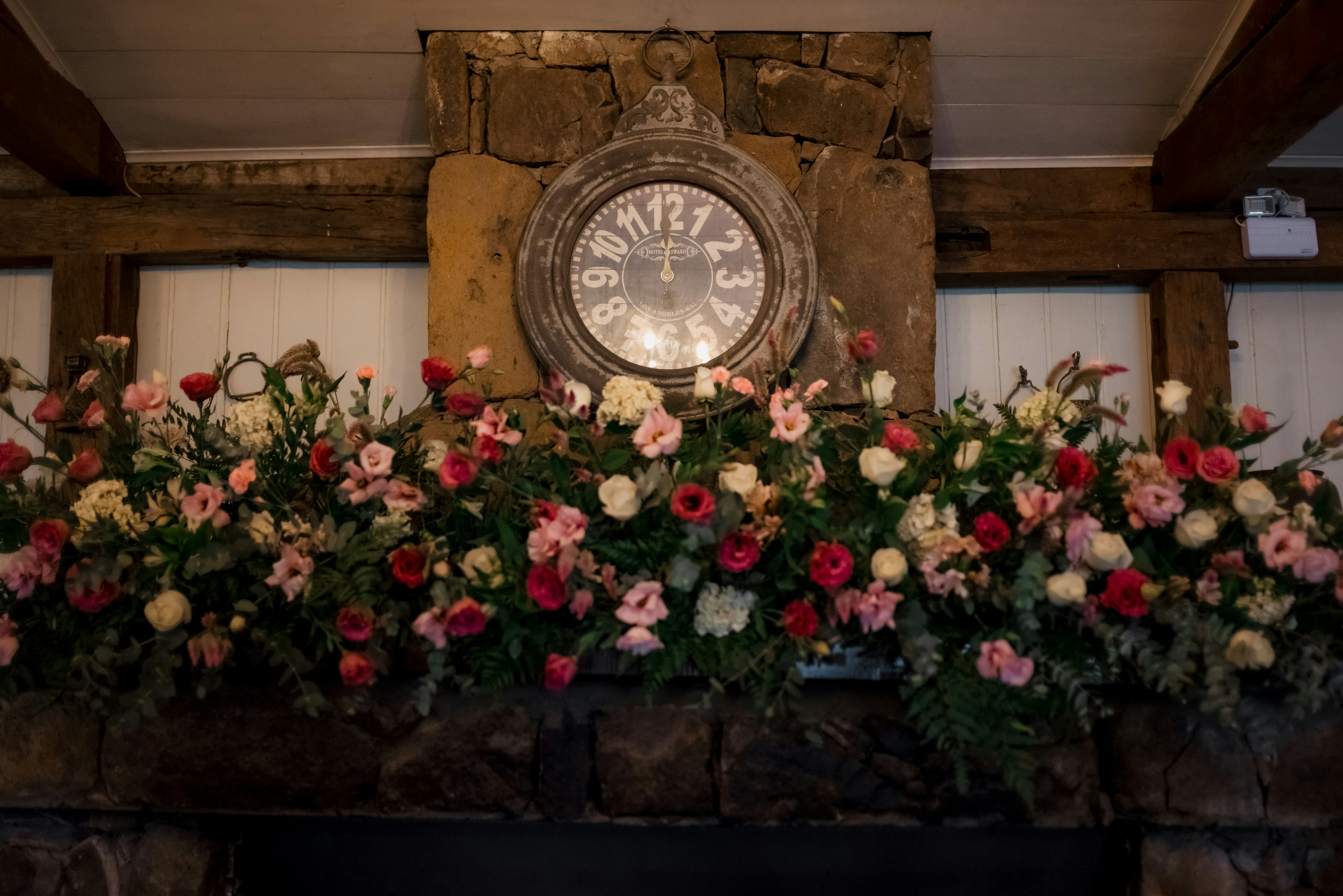 Floral Crown Above Time: A Clock Framed by Blooms