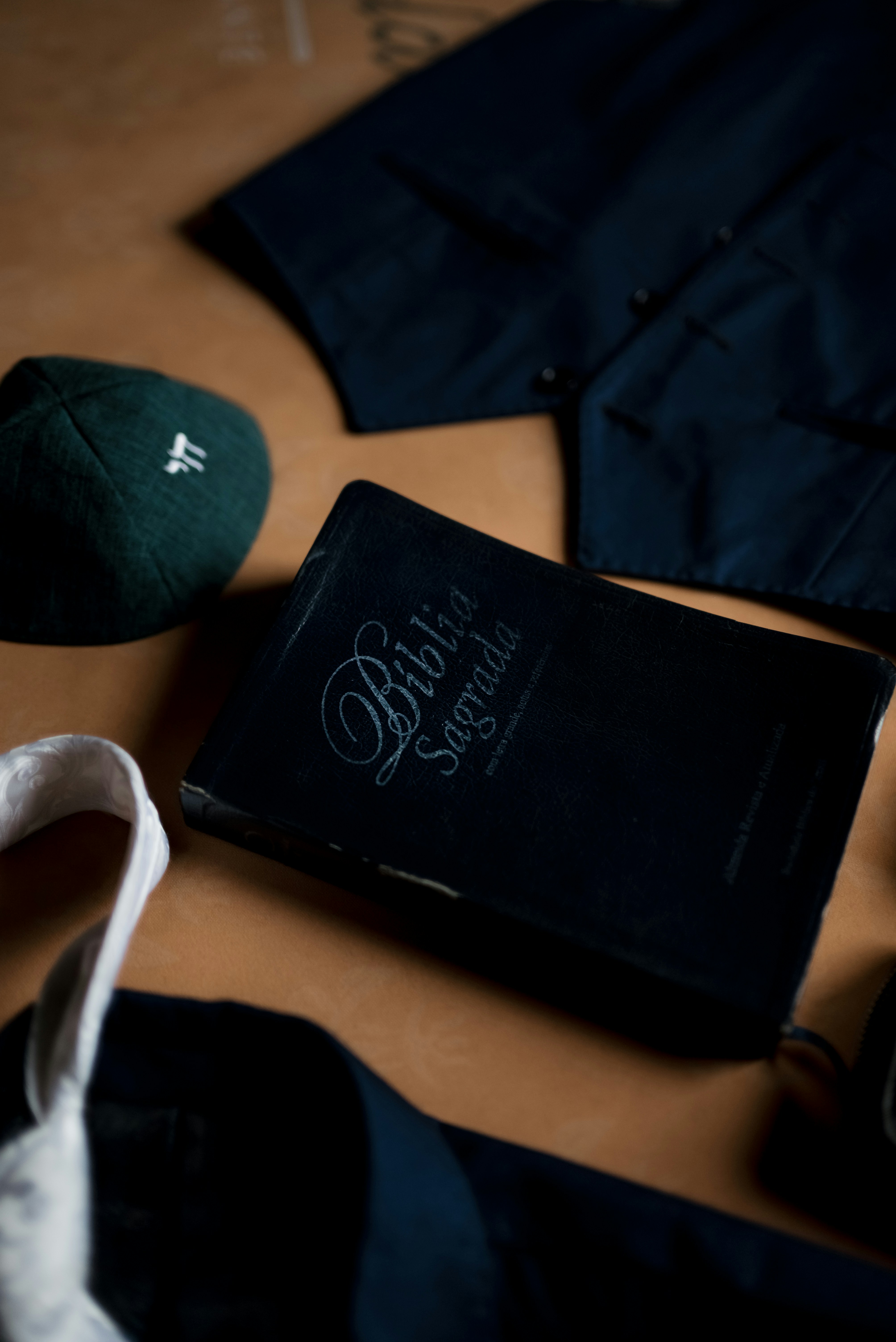 Unfolding Quiet Secrets: A Leather-Bound Keepsake on a Warm Surface