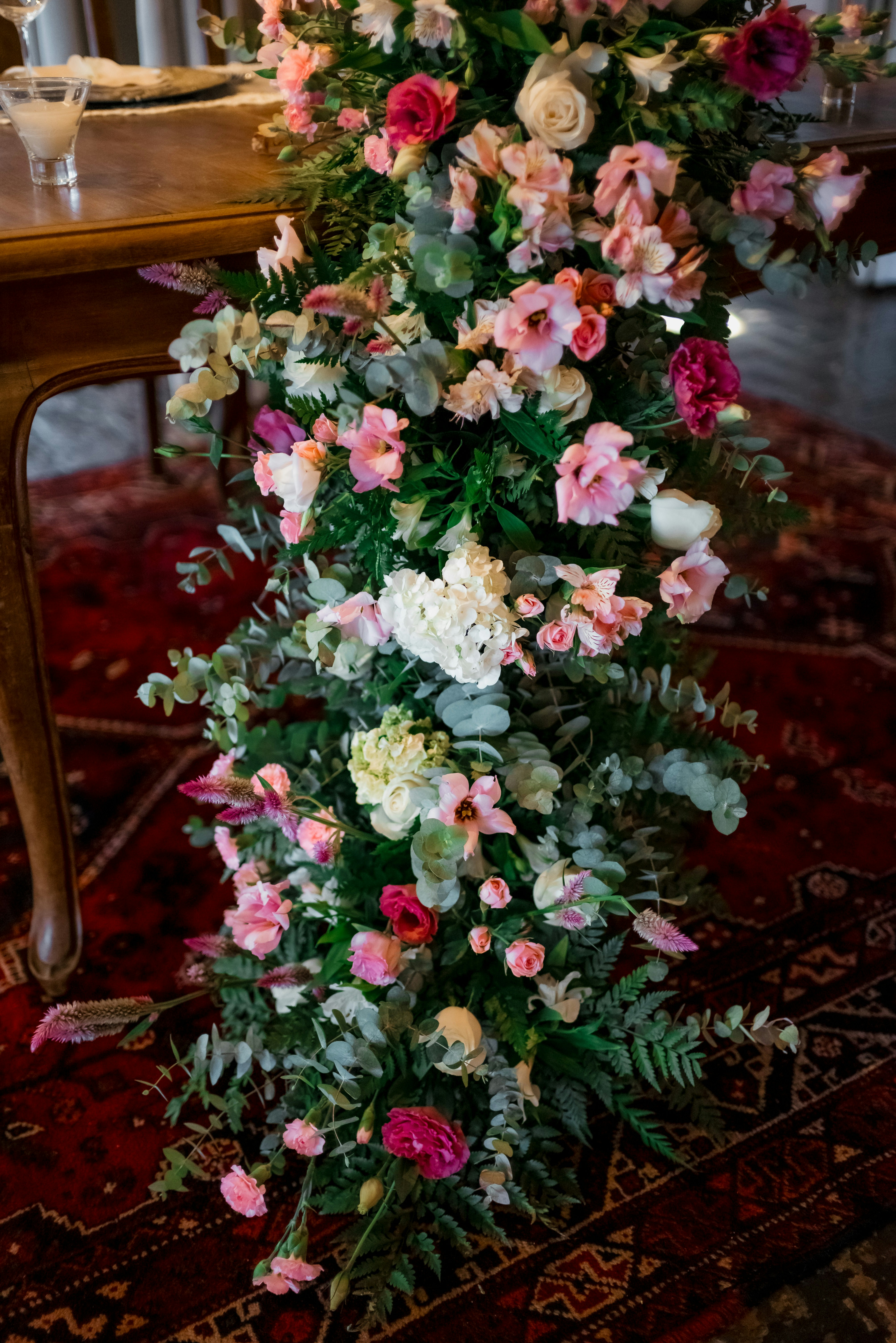 Floral Cascade Draping a Velvet Carpet: A Table-Front Floristry Display