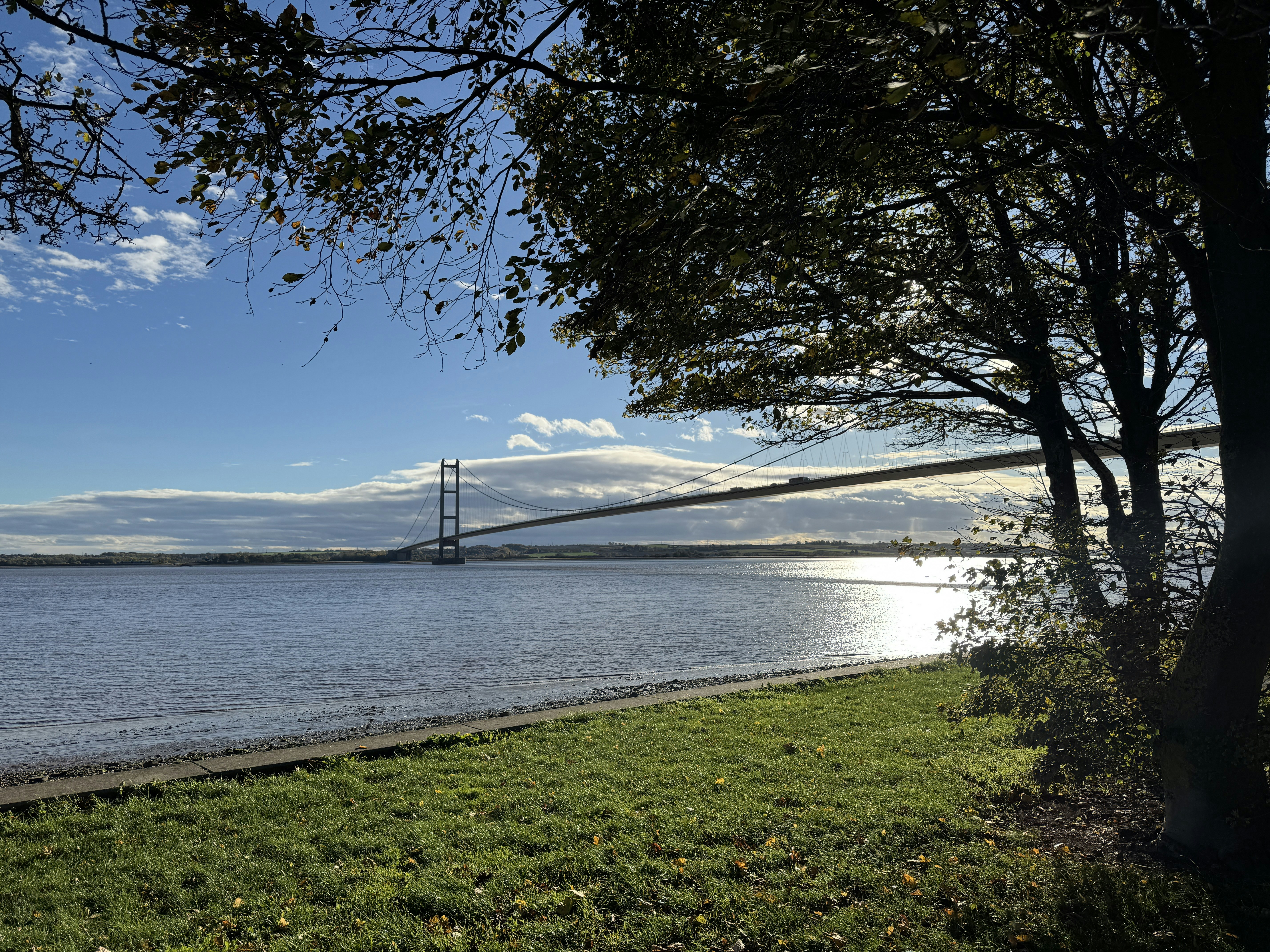 Bridge by the River: Thursday afternoon light over the calm bank