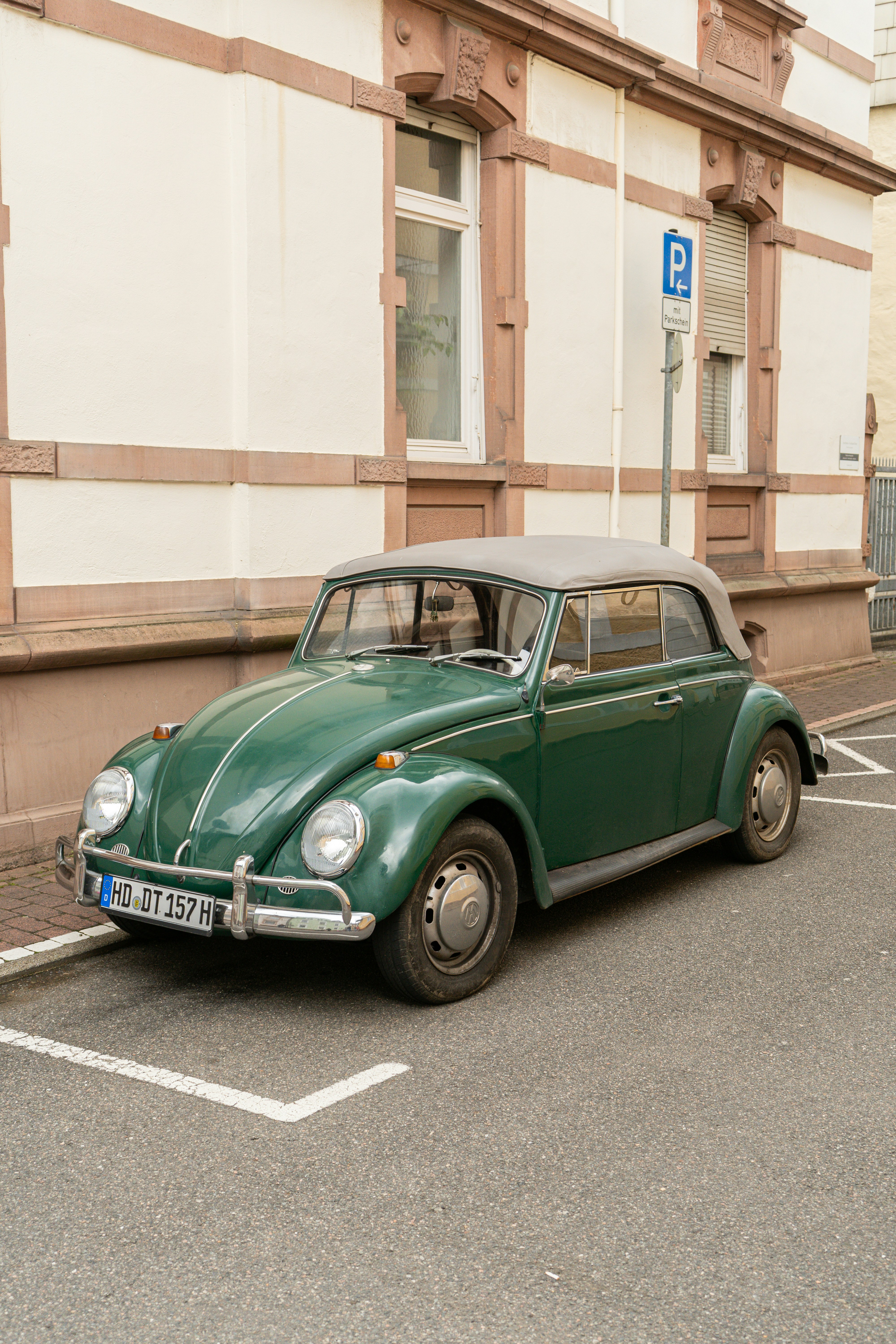 Green Vintage Beetle in a Quiet European Street