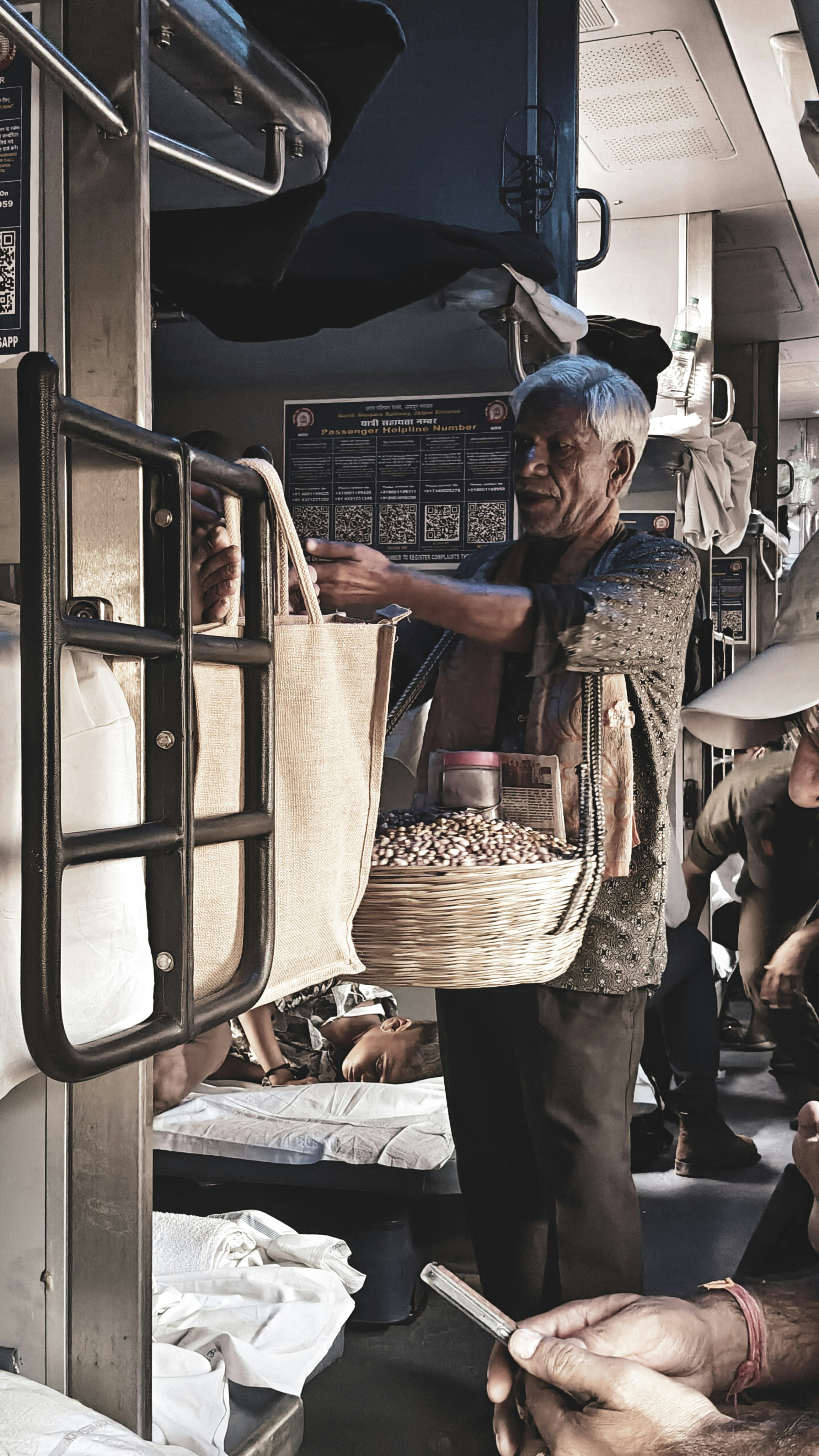 Basket Seller Aboard: A Merchant in Transit with a Looming Basket of Goods
