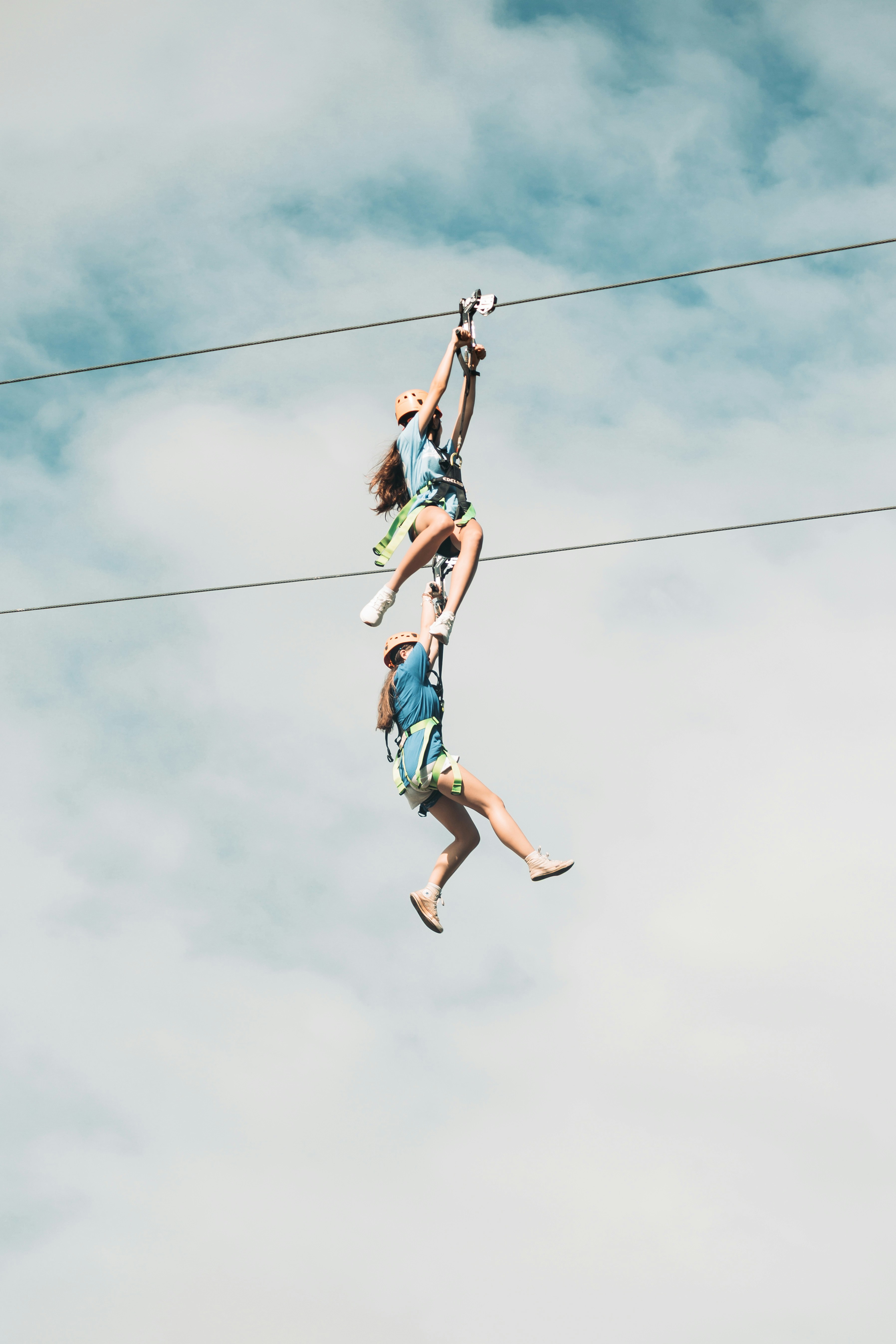 Two Runners on the Zipline: A Moment of Flight
