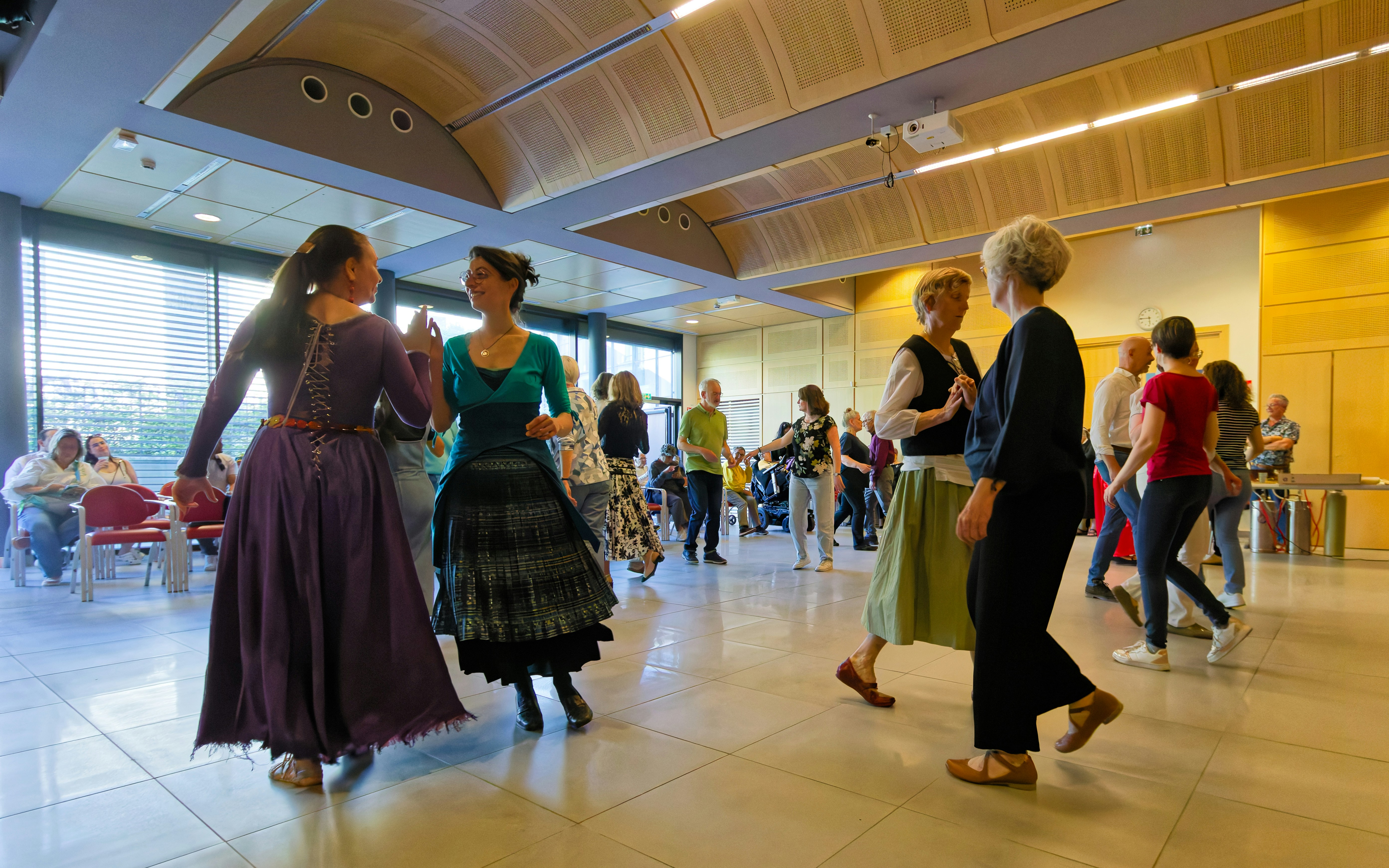 Dancers in a Sunlit Hall Spark with Movement