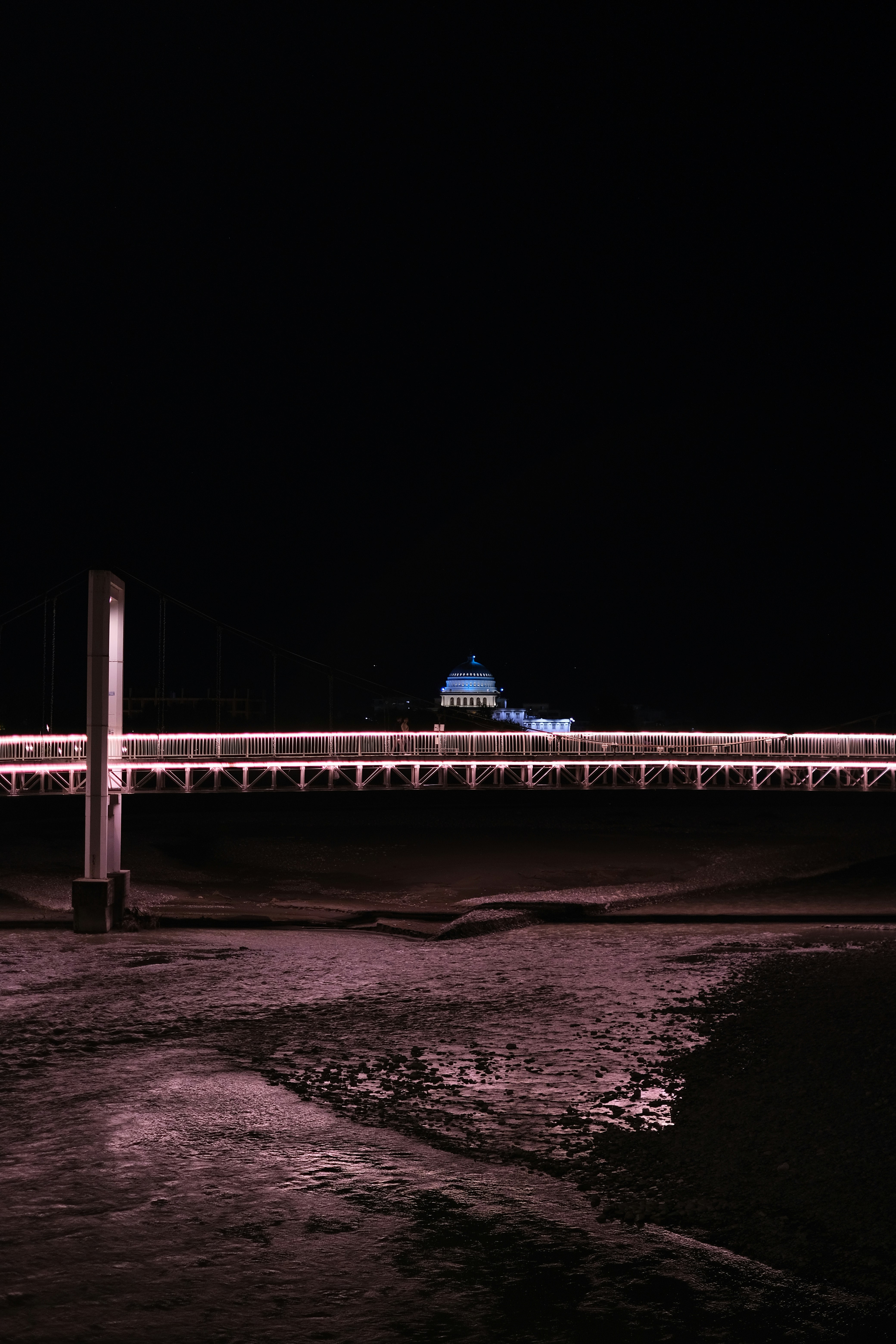 Illuminated Bridge Over Quiet Tide with Aglow Capitol Dome