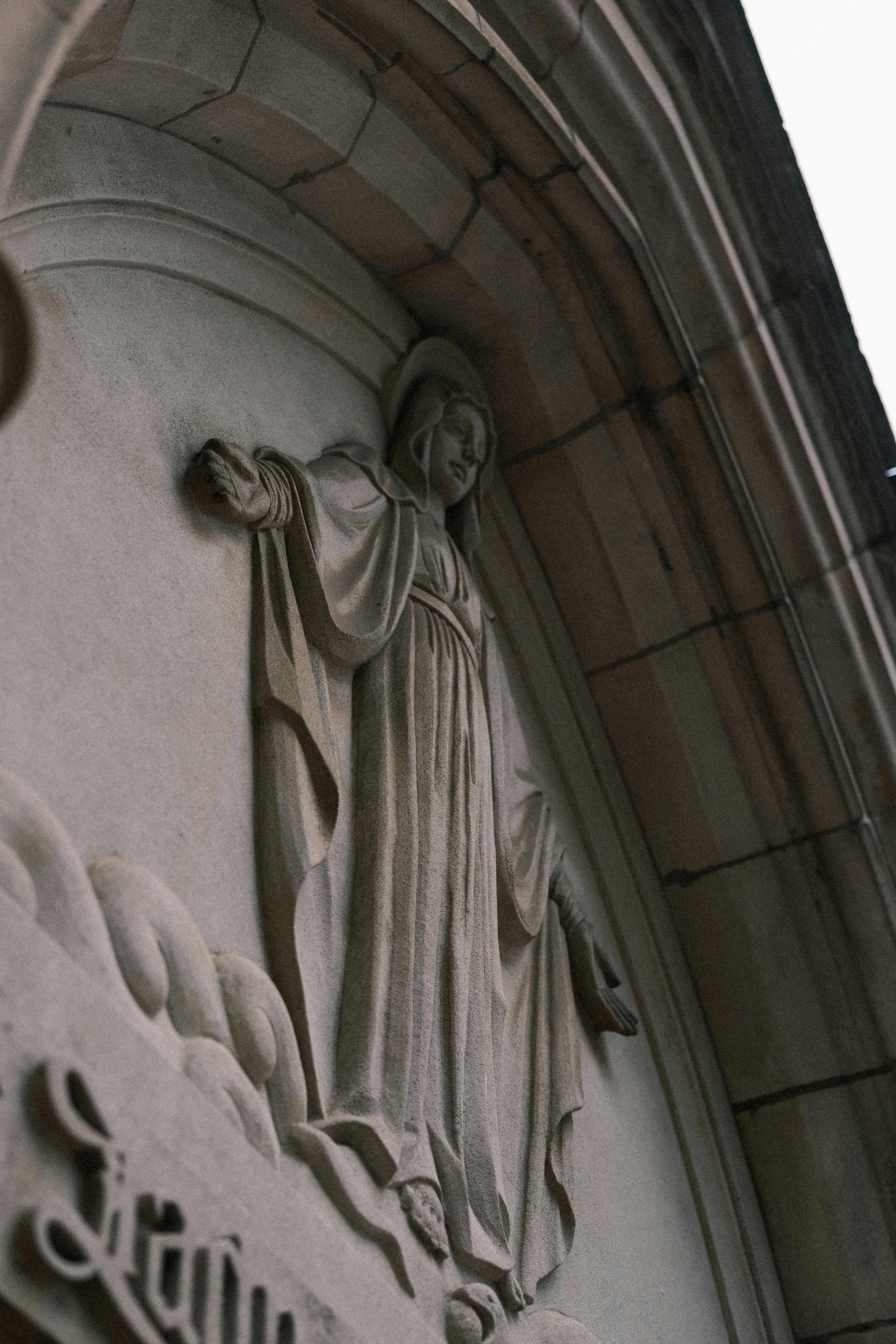 Stone Angel: A Silent Figure Reaching Toward the Arch of Time