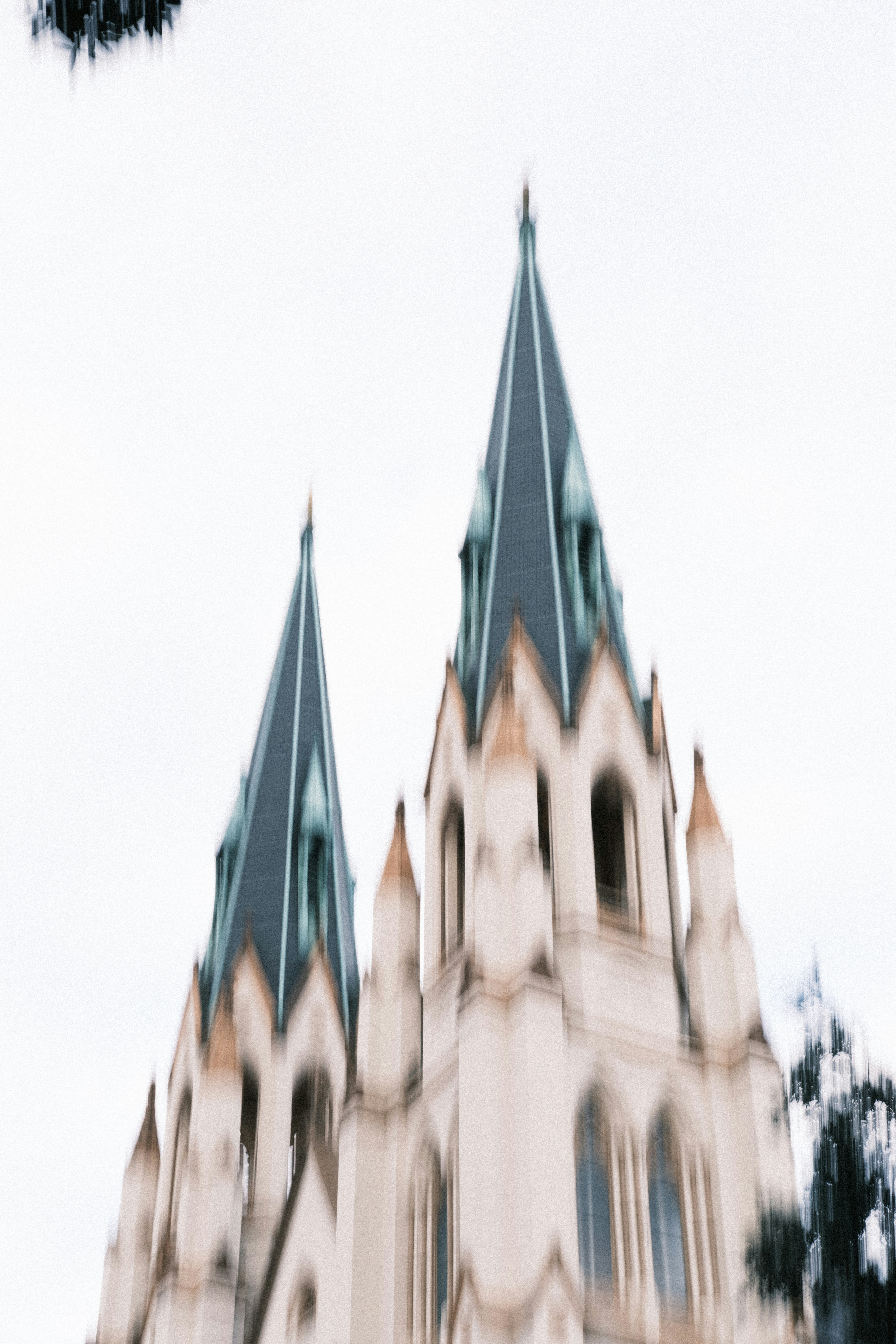 Blurry Gothic Towers Stretch Toward a Pale Sky