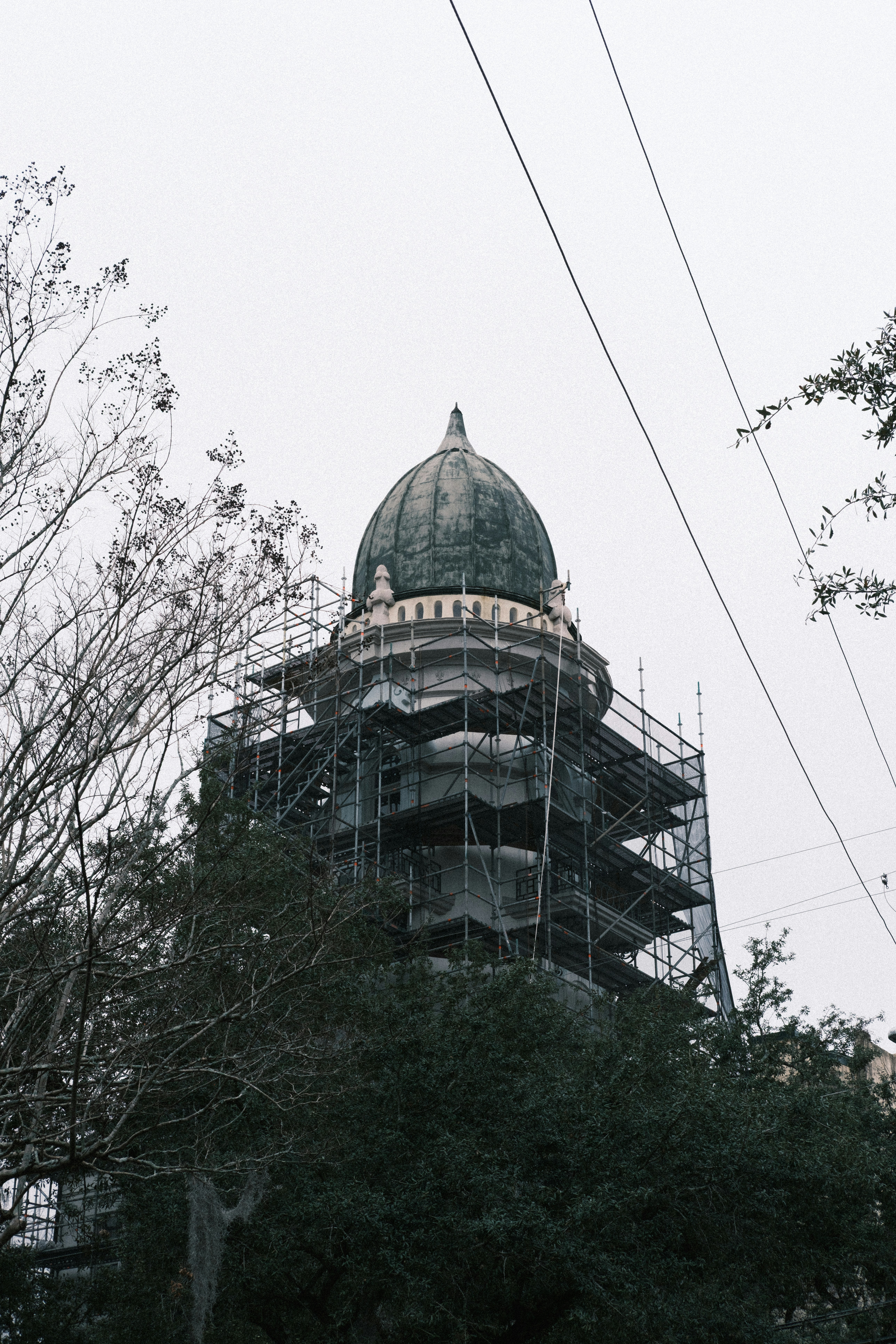 Winding scaffolding around a dome: a historic tower under restoration