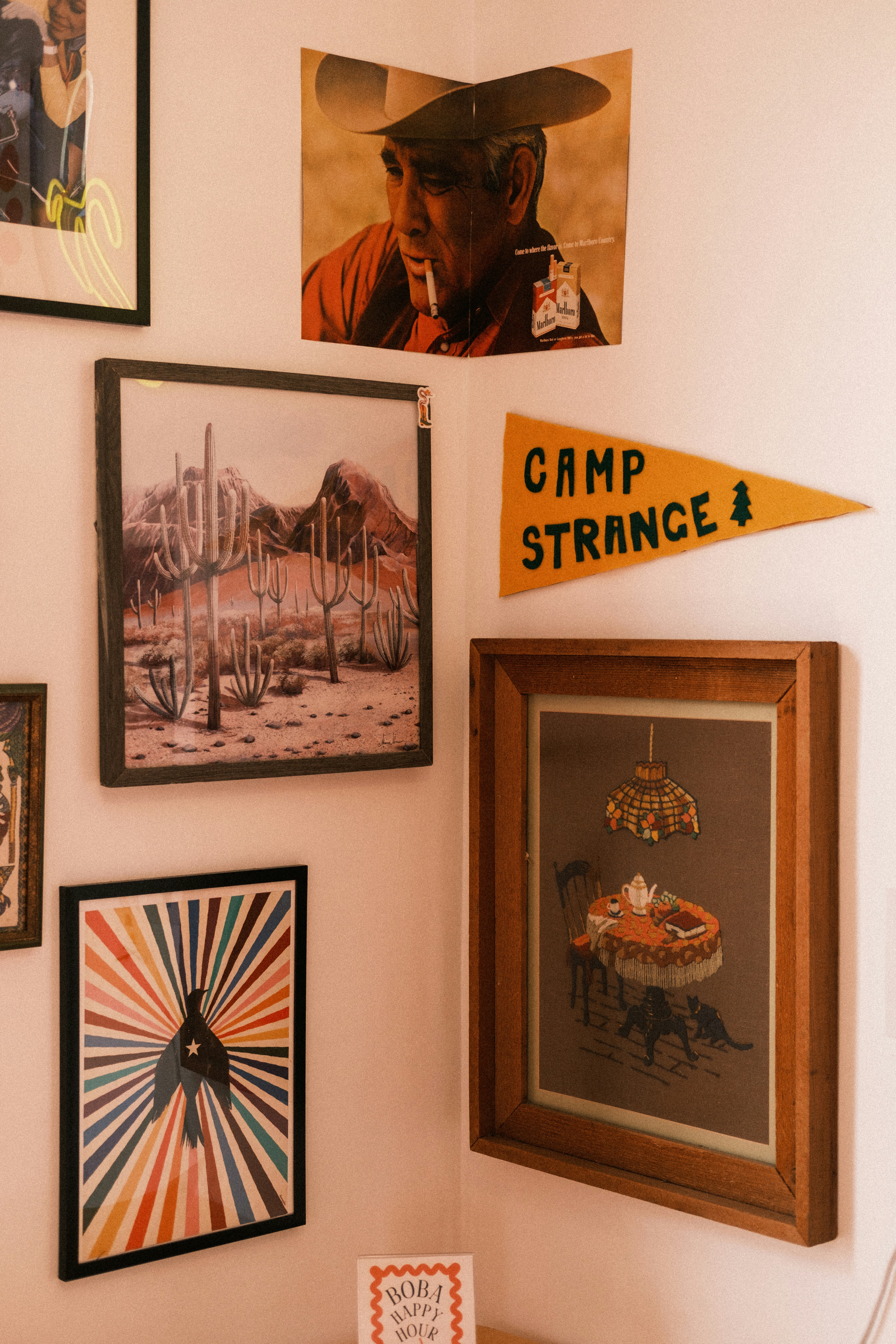 Canyon Wall Art: Desert Scenes and Camp Sign Adorning a Cozy Corner
