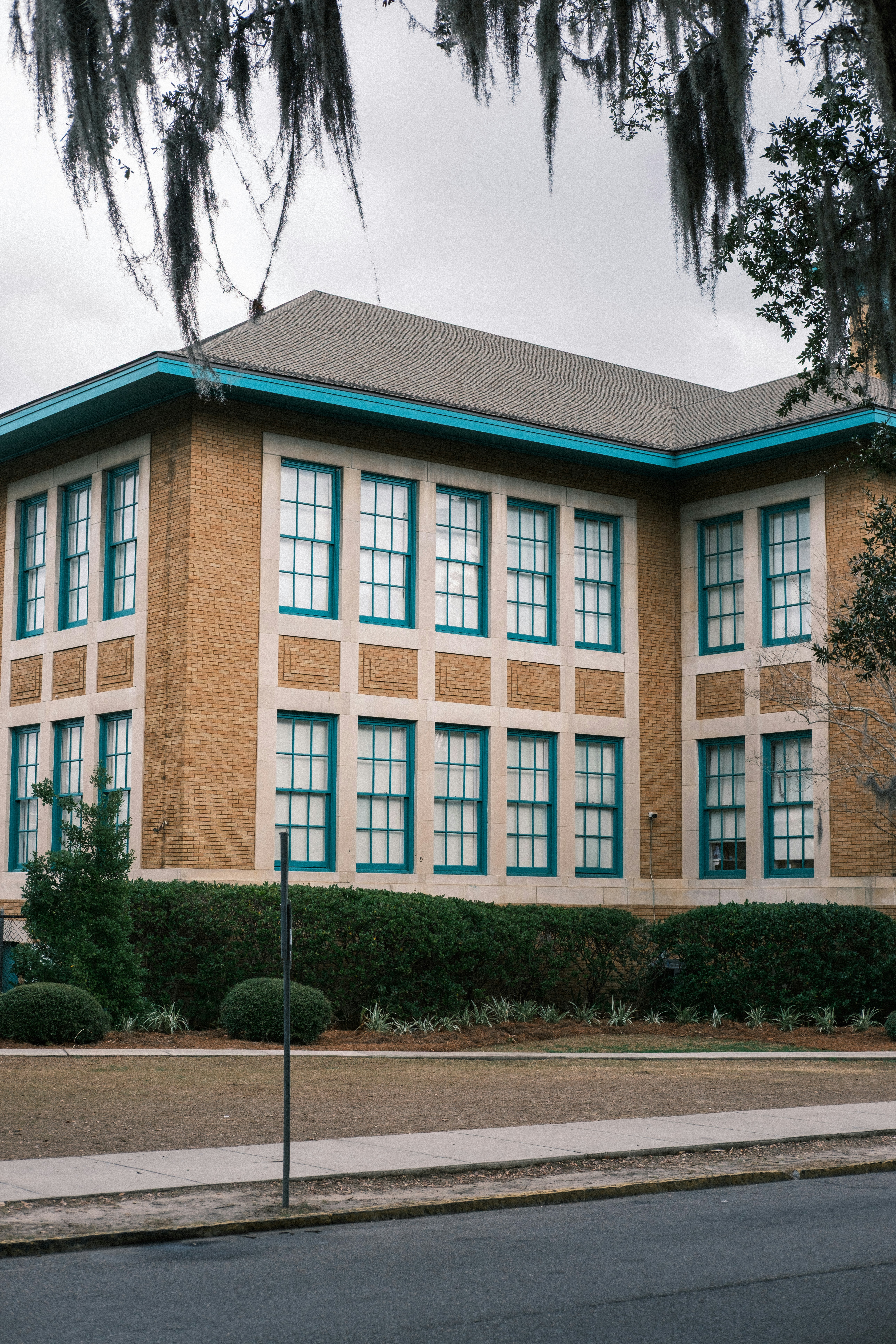 Teal-Accented Corner of a Brick Campus Building