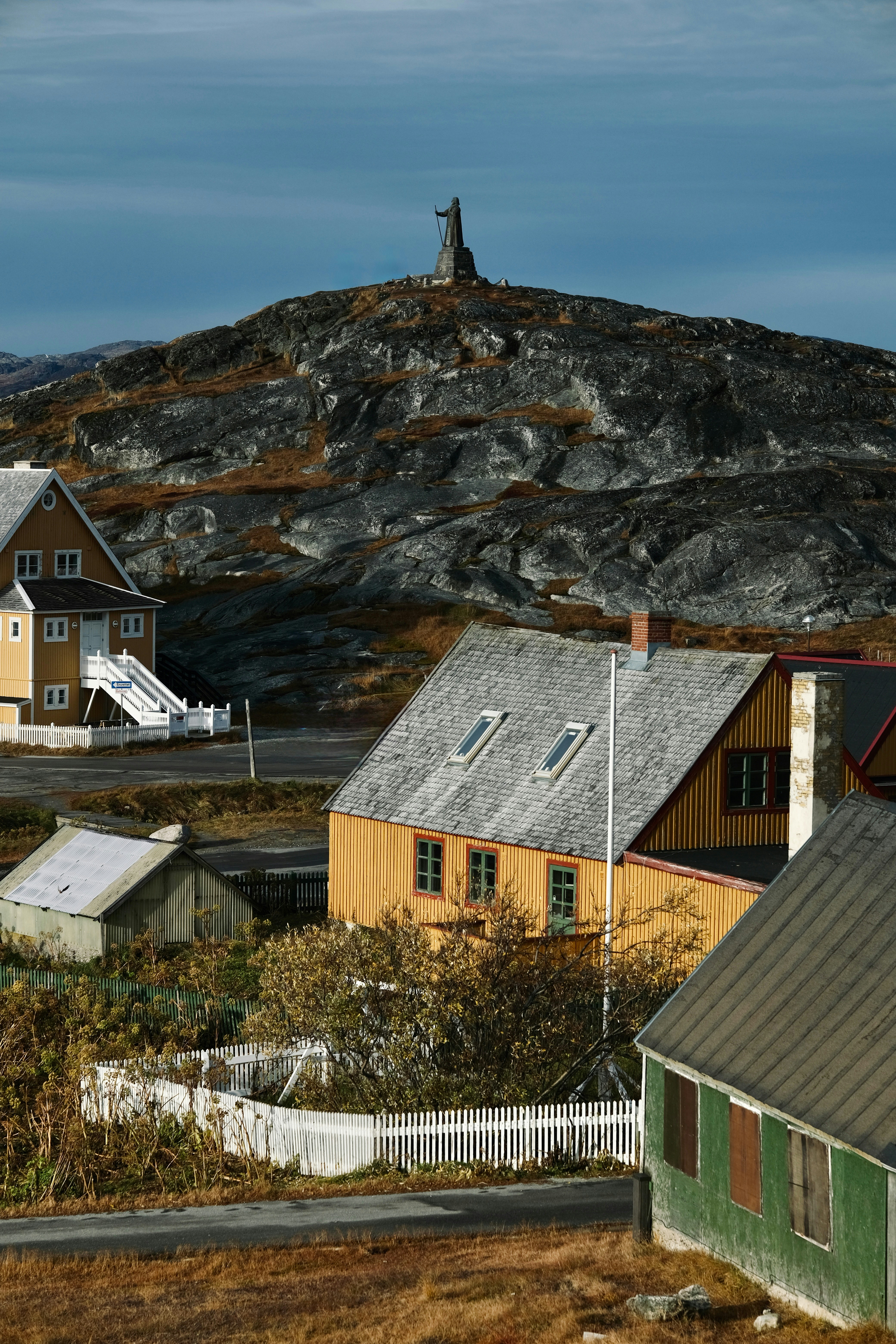 Clifftop Monument Over a Coastal-Village Orchard