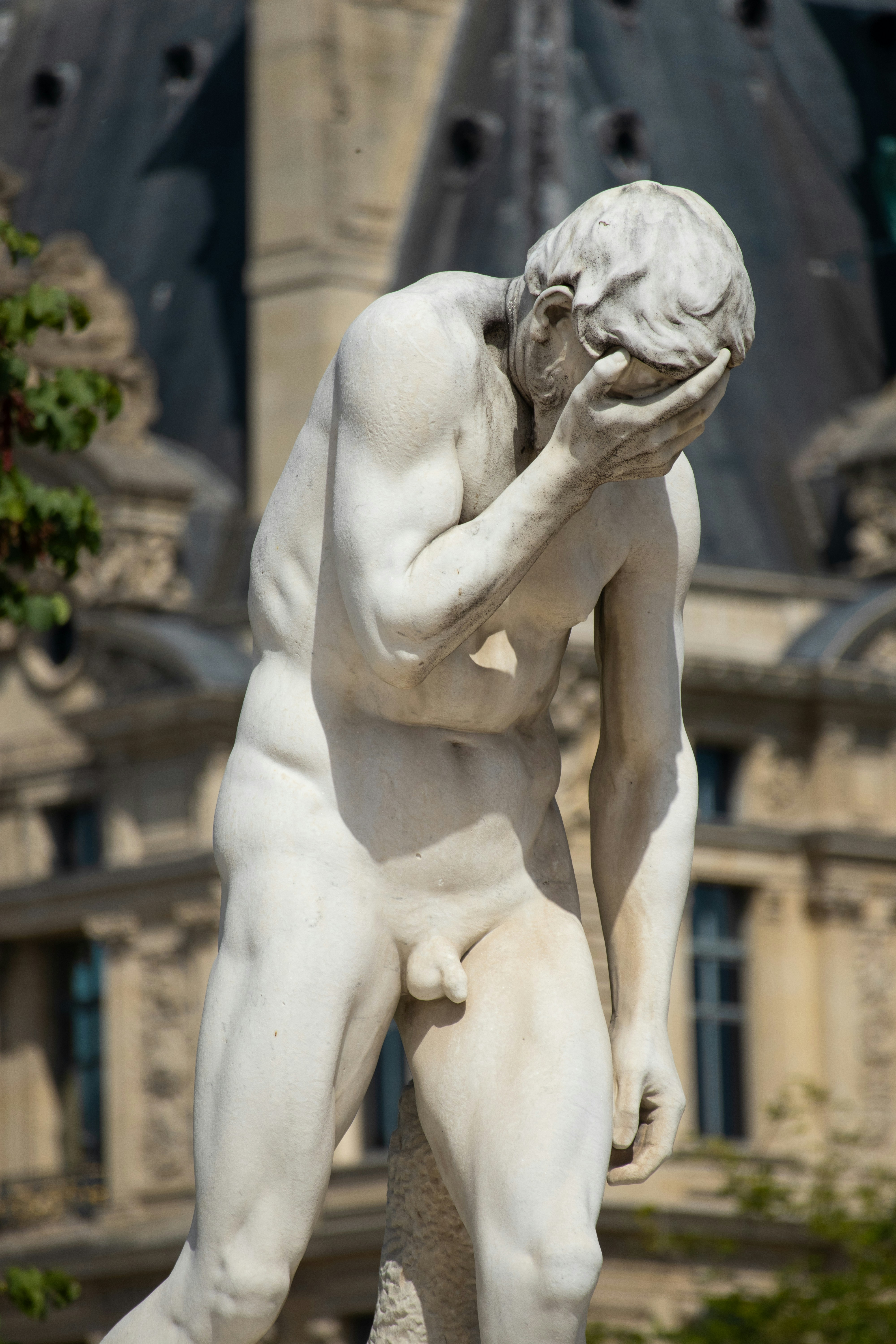 Stone Paradox: A Pensive Classical Nude Against Urban Grandeur