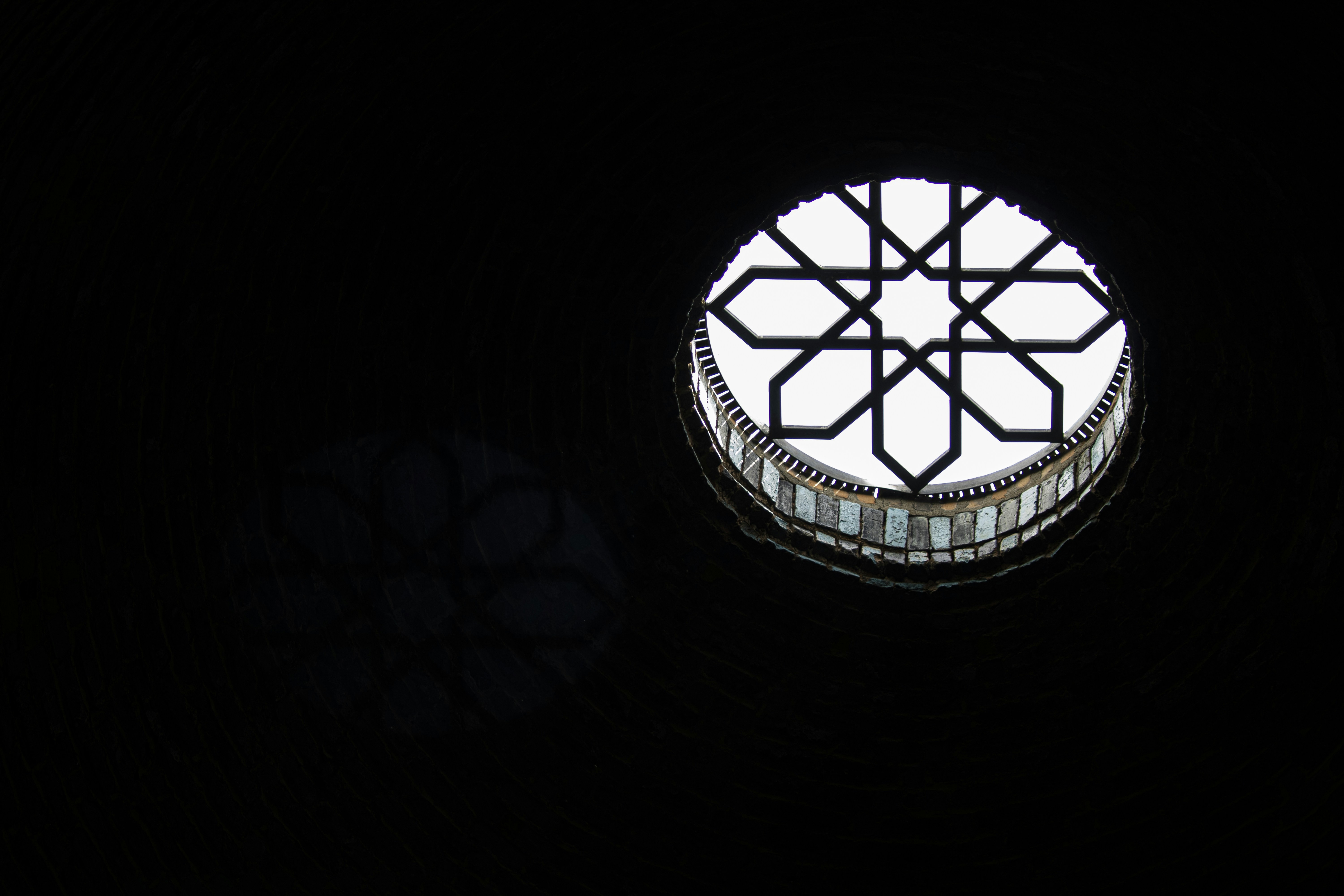 Crescent Window: Geometric Lattice Framed by Darkness