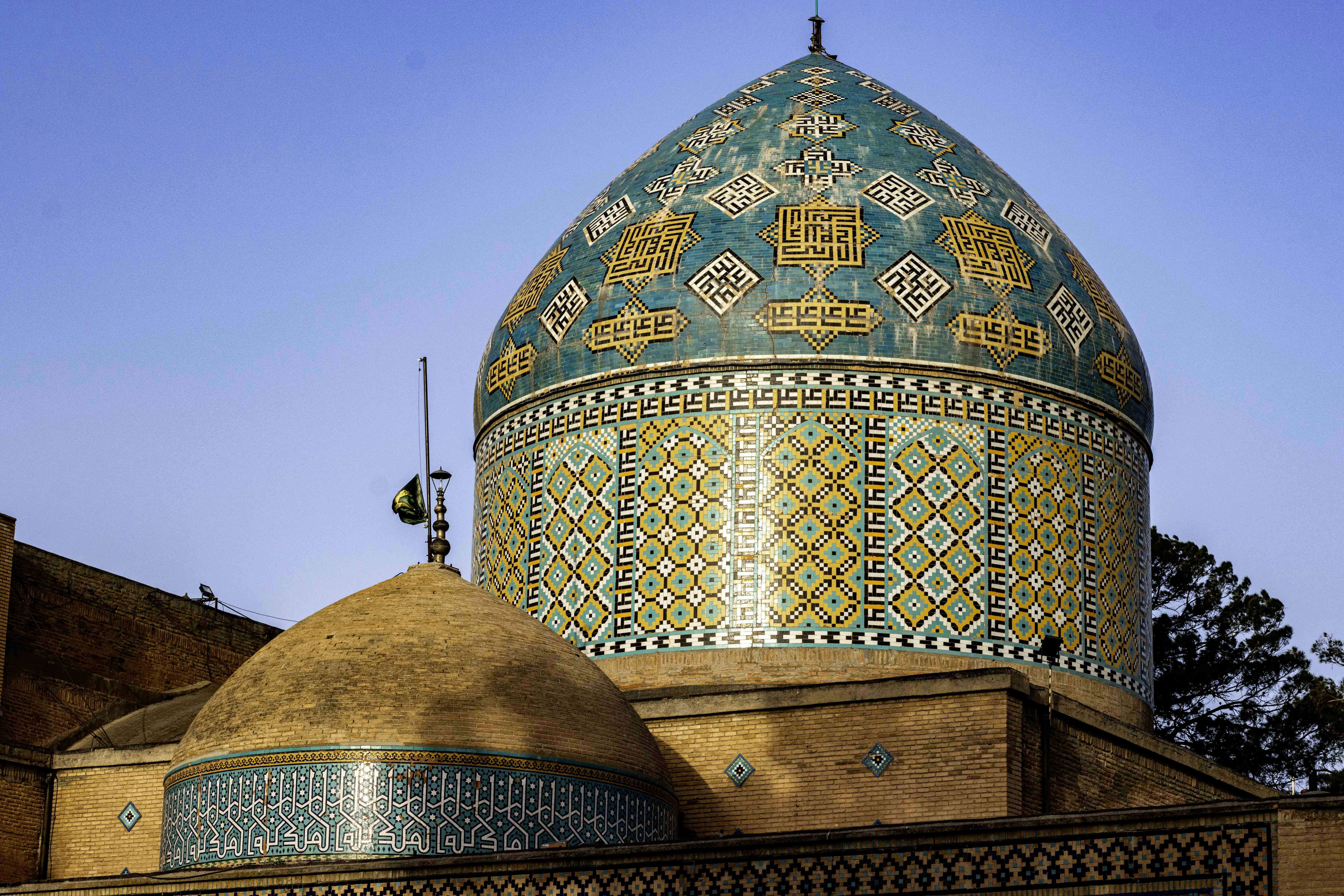 Cerulean Dome: Moorish Tilework Crowned by a Golden Crescent