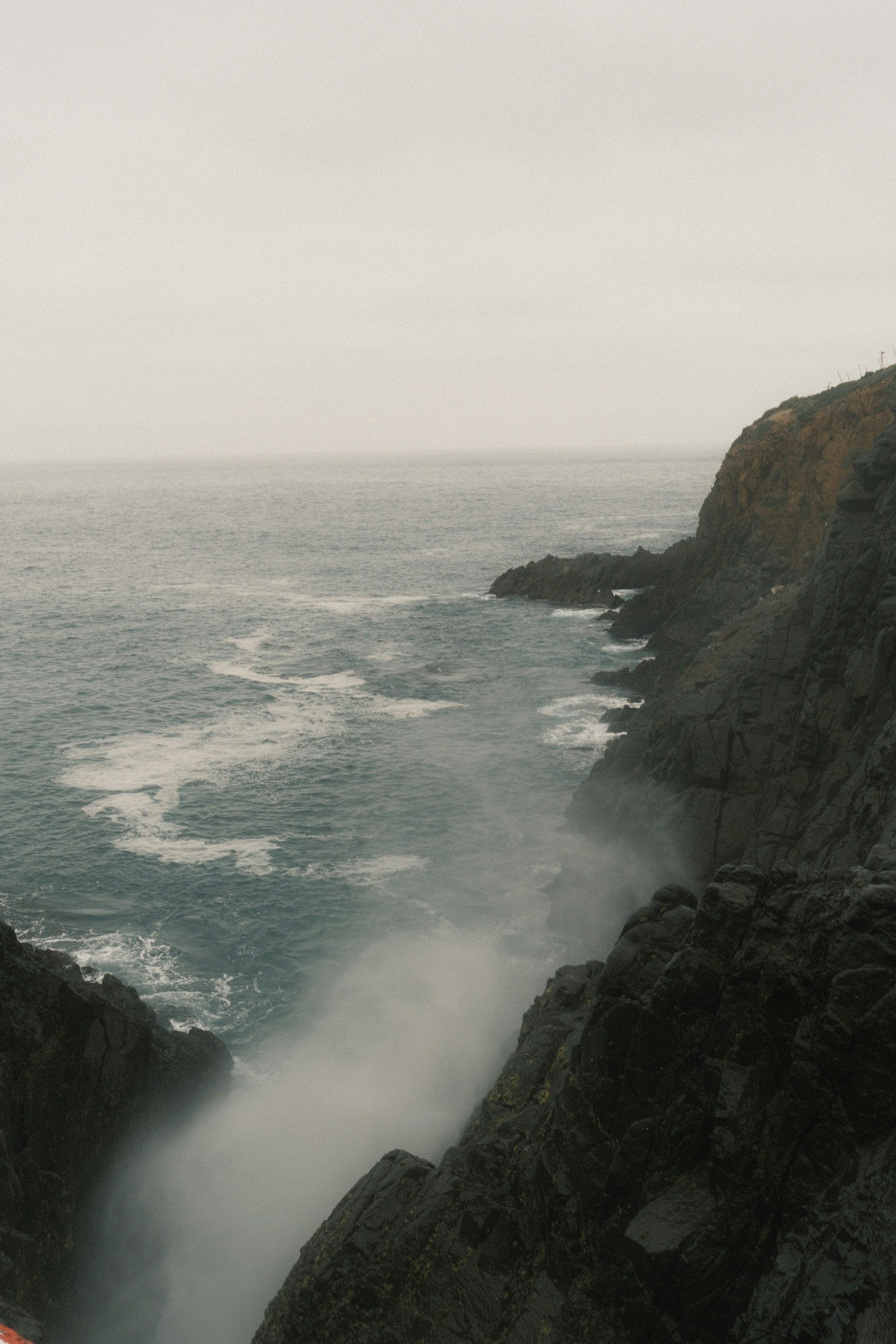 Cliffside Spray: Ocean Ecstasy Colliding with Darkstone Ridge