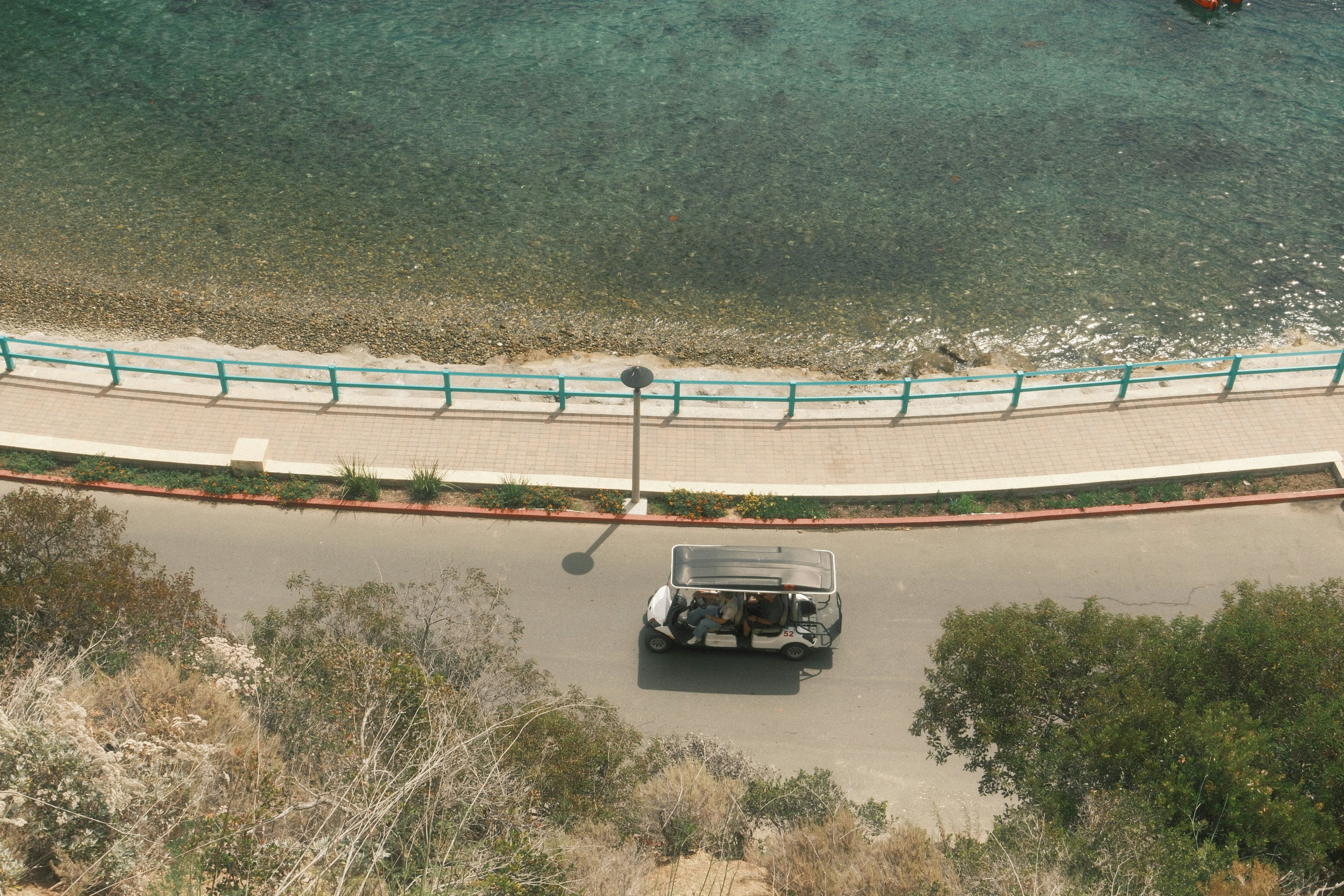 Aerial Glimpse: Beachfront Roadside Jeep Moments