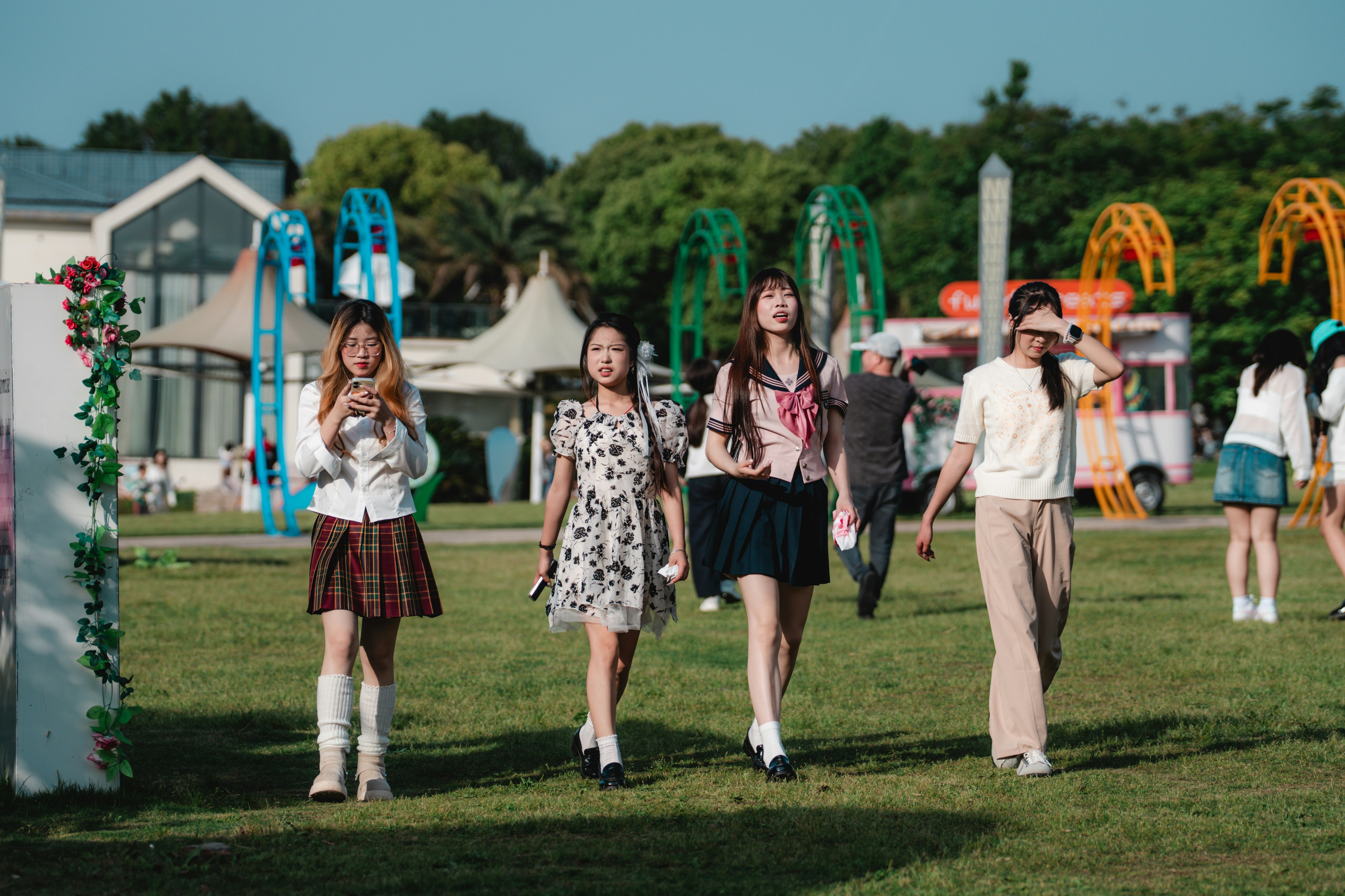 Group of Friends Strolling Through a Sunlit Park Playground