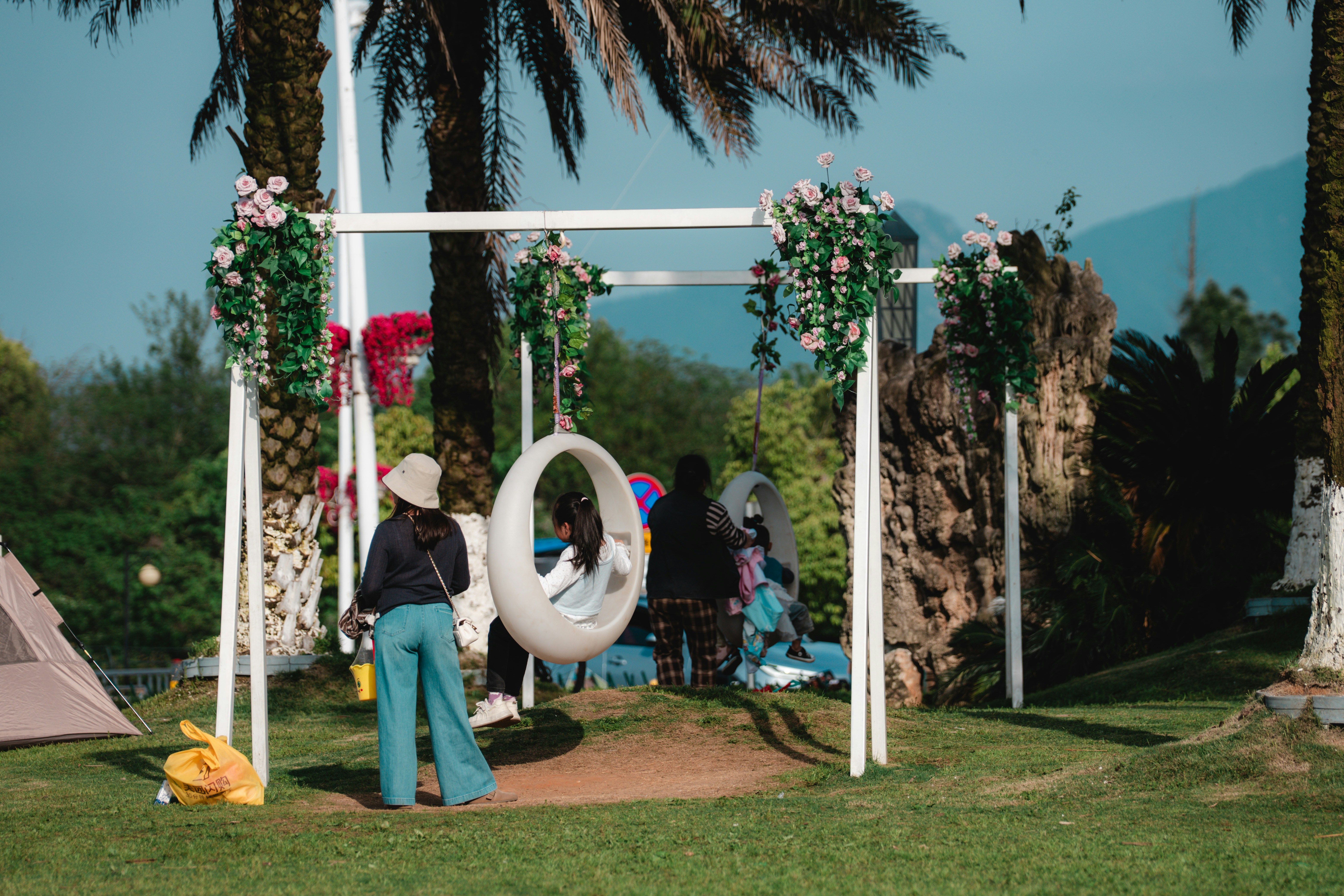 Tire Swing Ensemble under Floral Arch in the Park