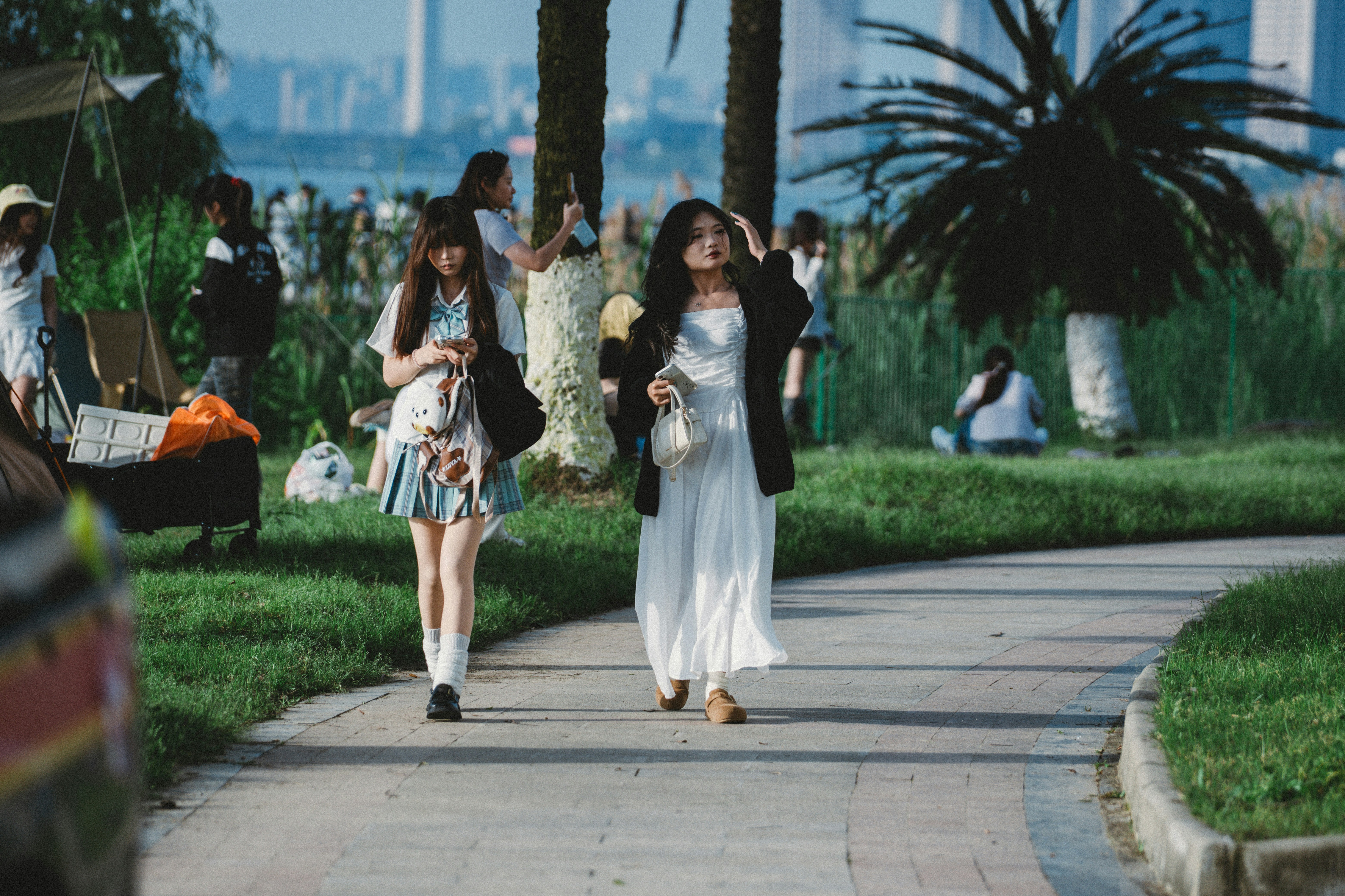 Walking in Light: A Trio of Young Women in a Sunny Park