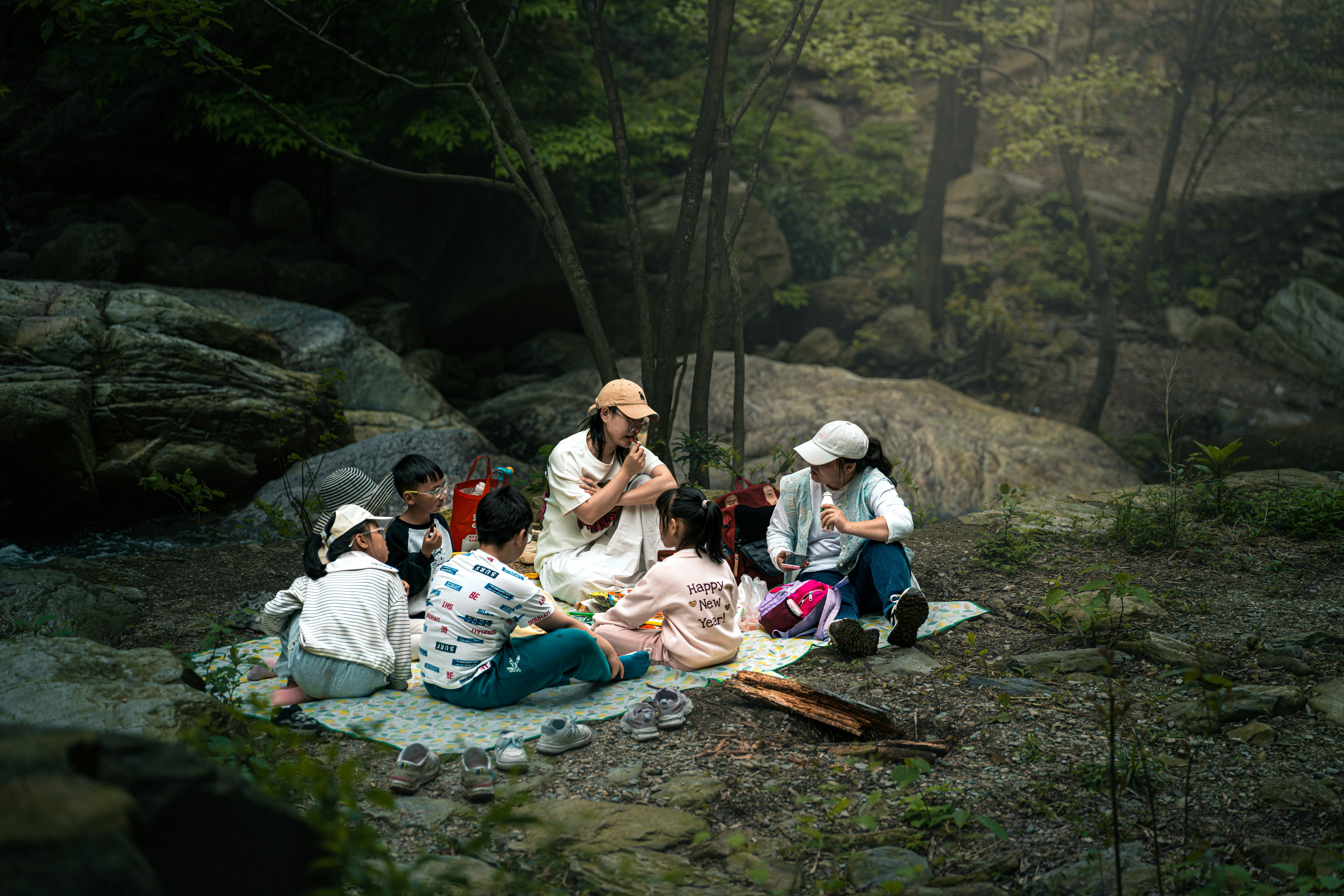 Forest Campfire Circle: a kids’ gathering on a mossy bank