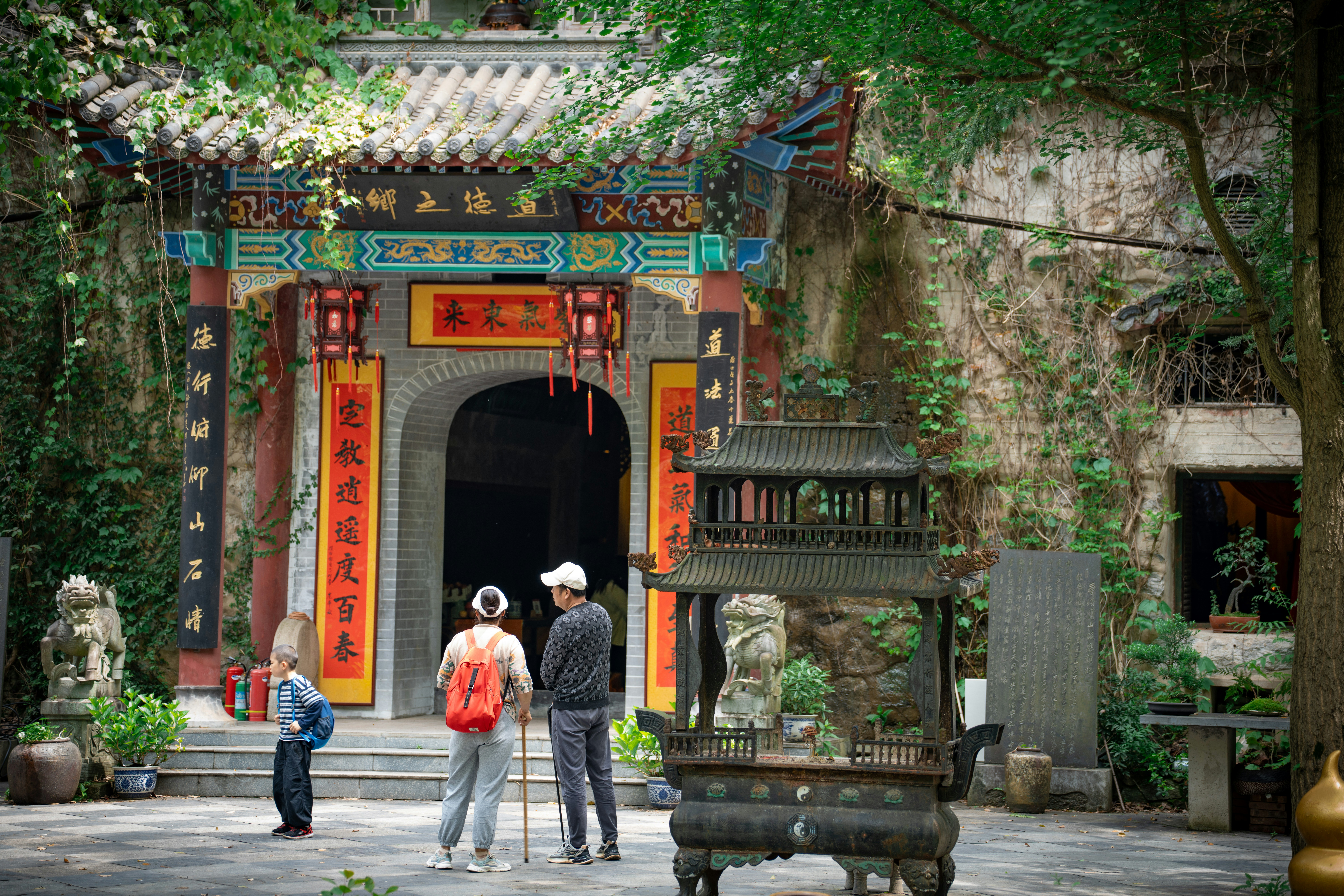 Temple Courtyard Encounter: Travelers Before the Ornate Gate