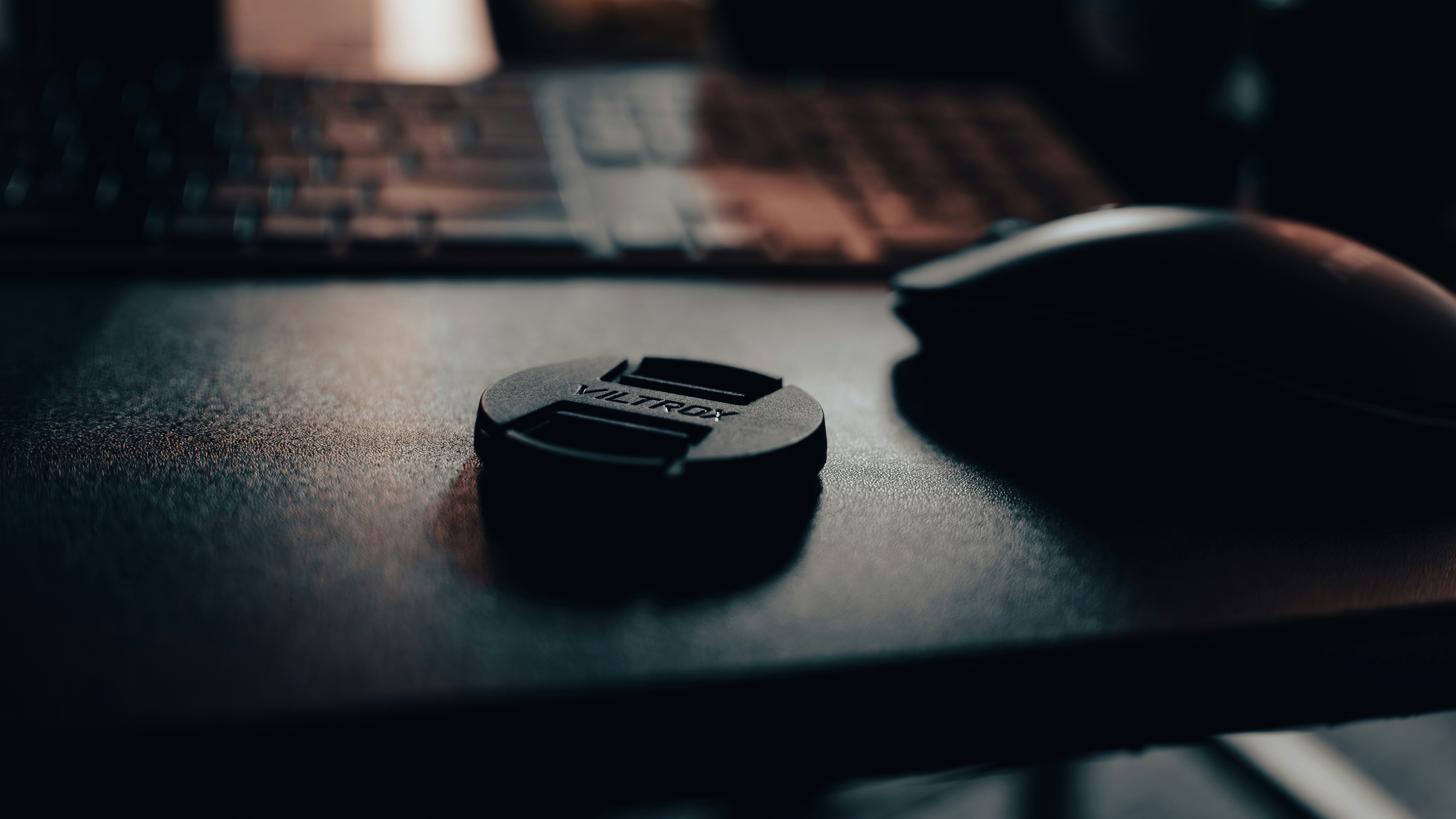 Lens Cap Pause: A Quiet Workspace Moment